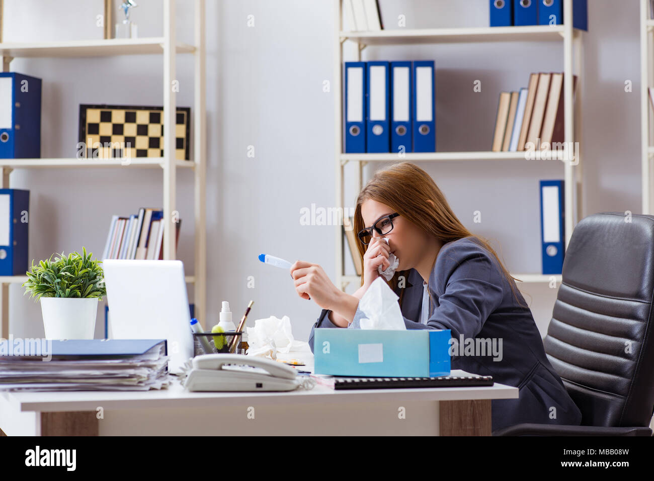 Businesswoman employee sick in the office Stock Photo - Alamy