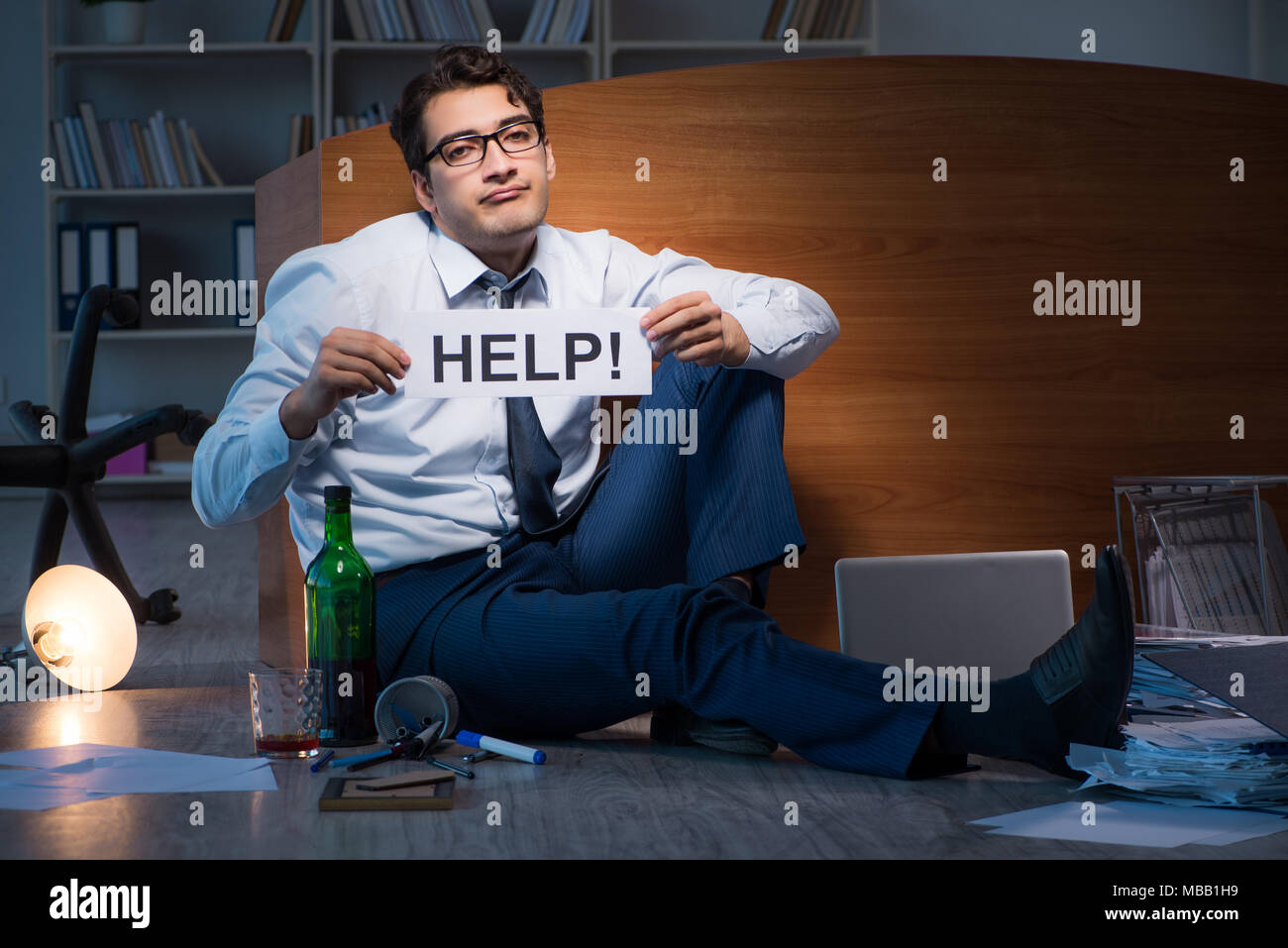 Employee asking for help and drinking under stress and despair Stock ...