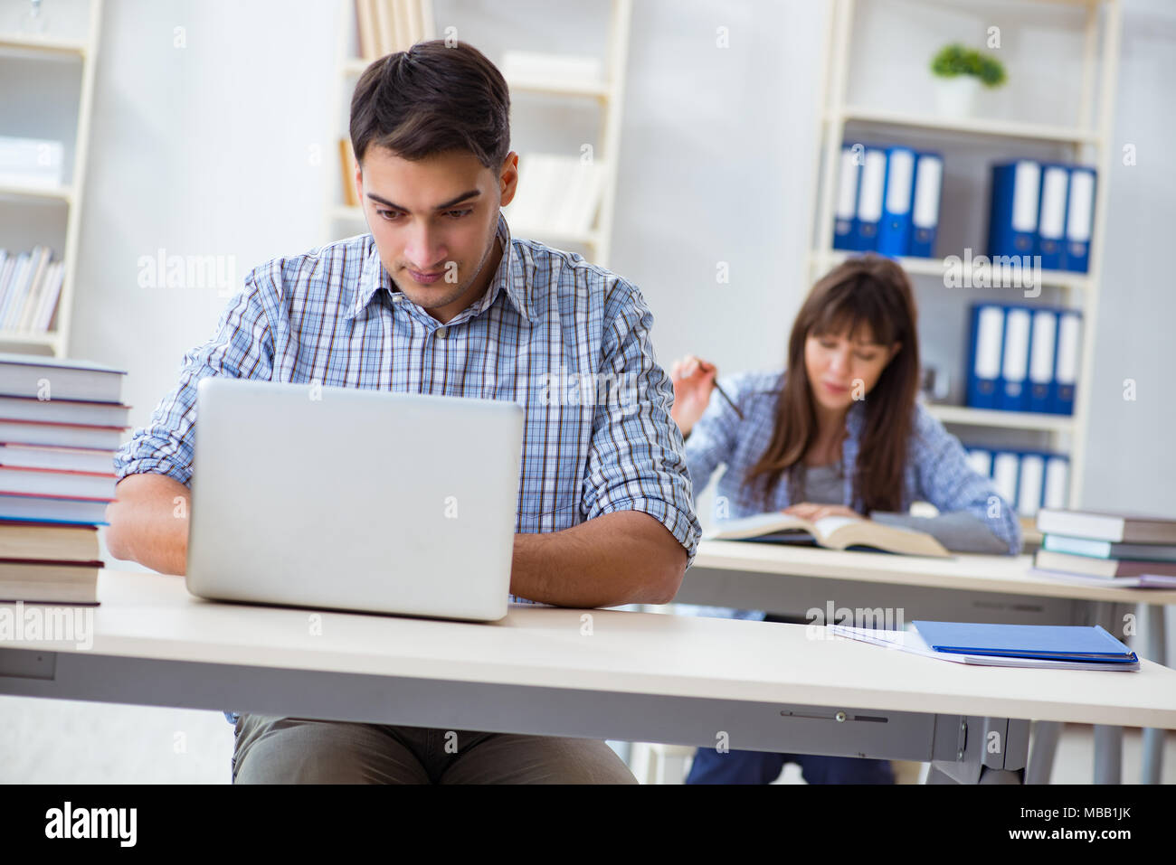 Students sitting and studying in classroom college Stock Photo - Alamy