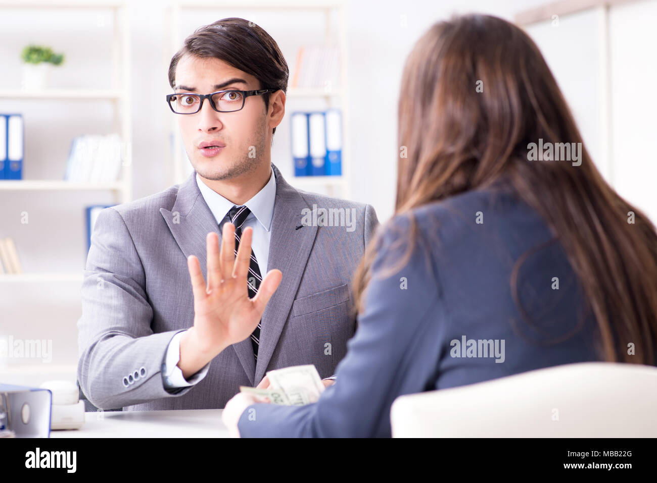 Businessman being offered bribe for breaking law Stock Photo - Alamy