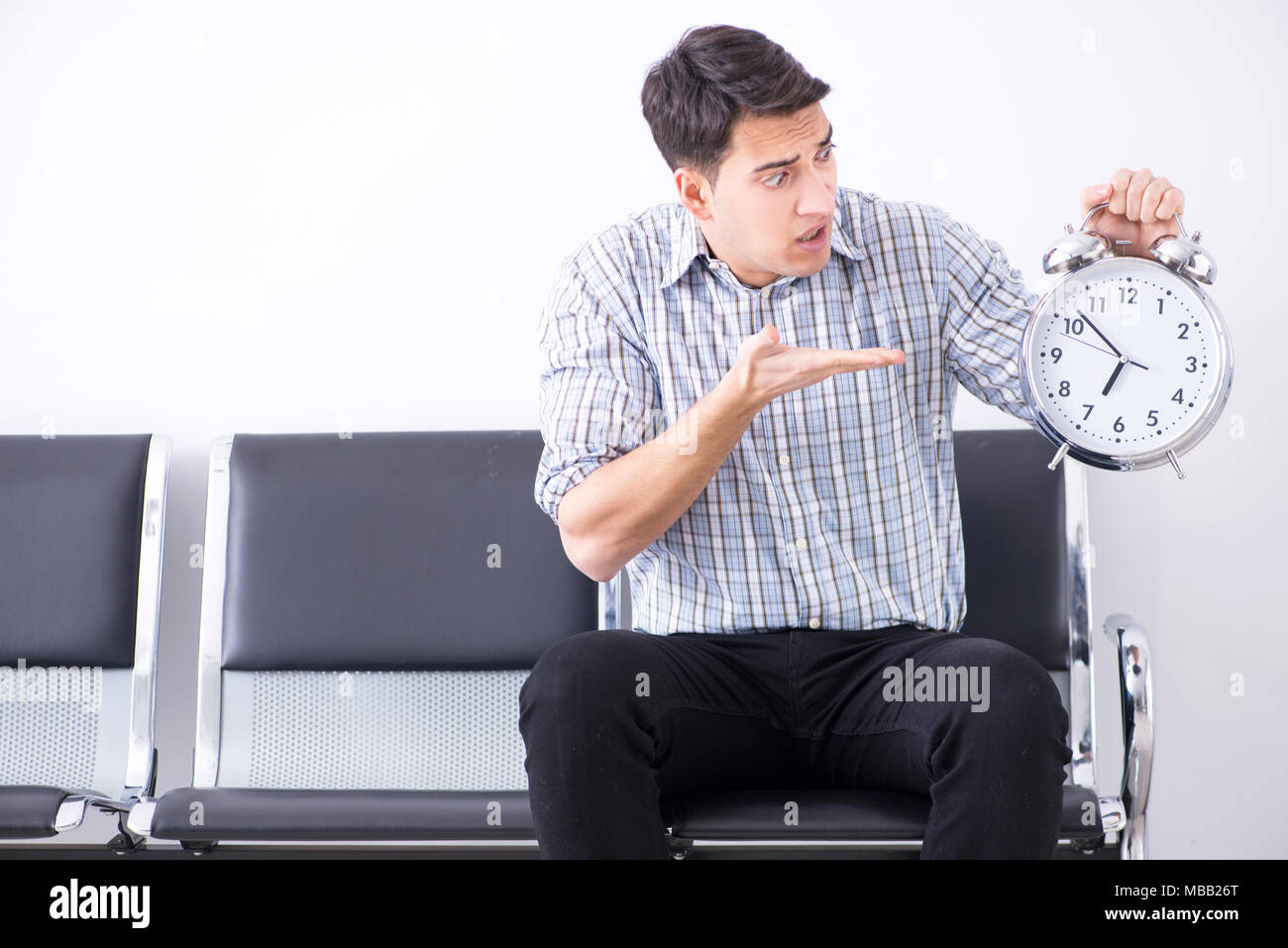 Man nervously impatiently waiting in the lobby Stock Photo - Alamy