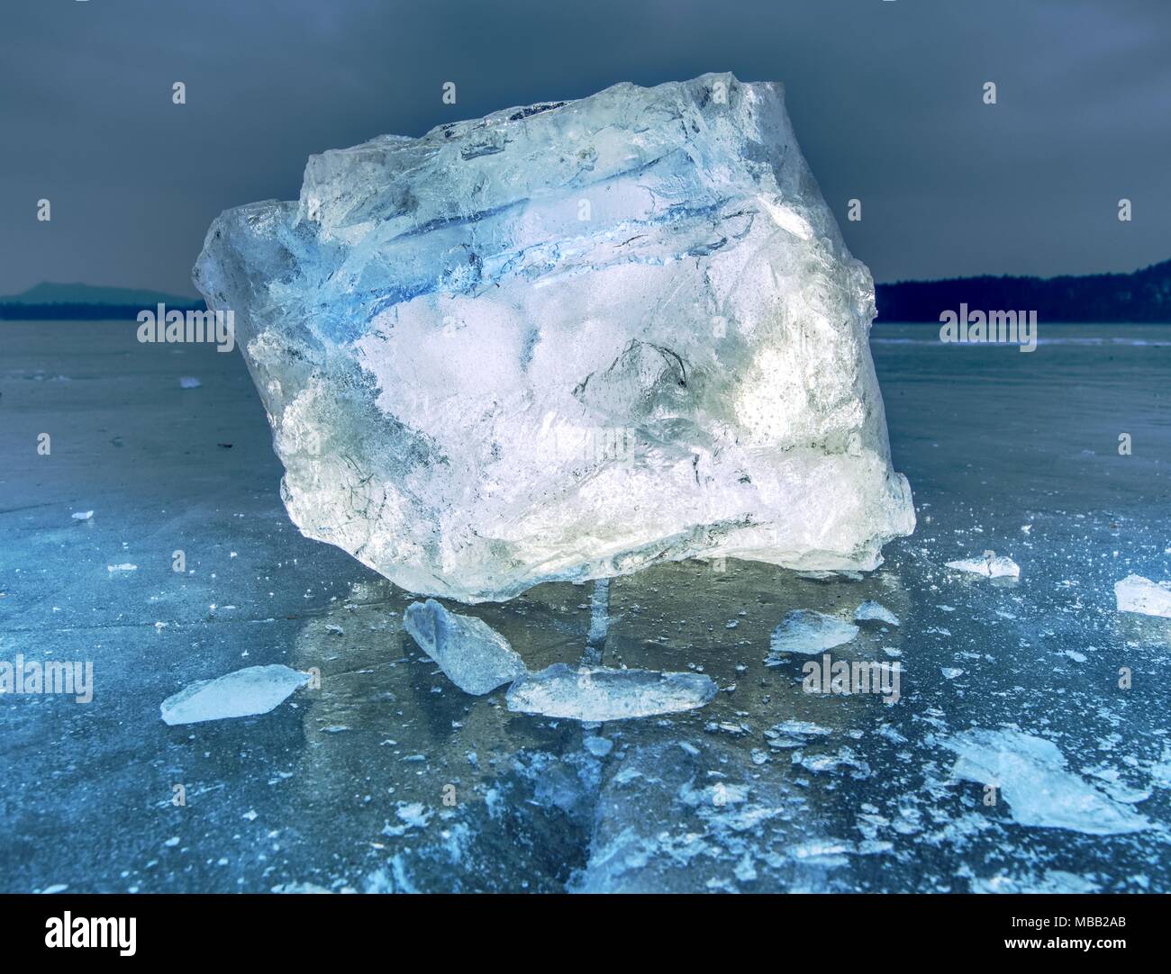 Icy winter landscape - thick ice covered ashore. Crashed ice floe on ...