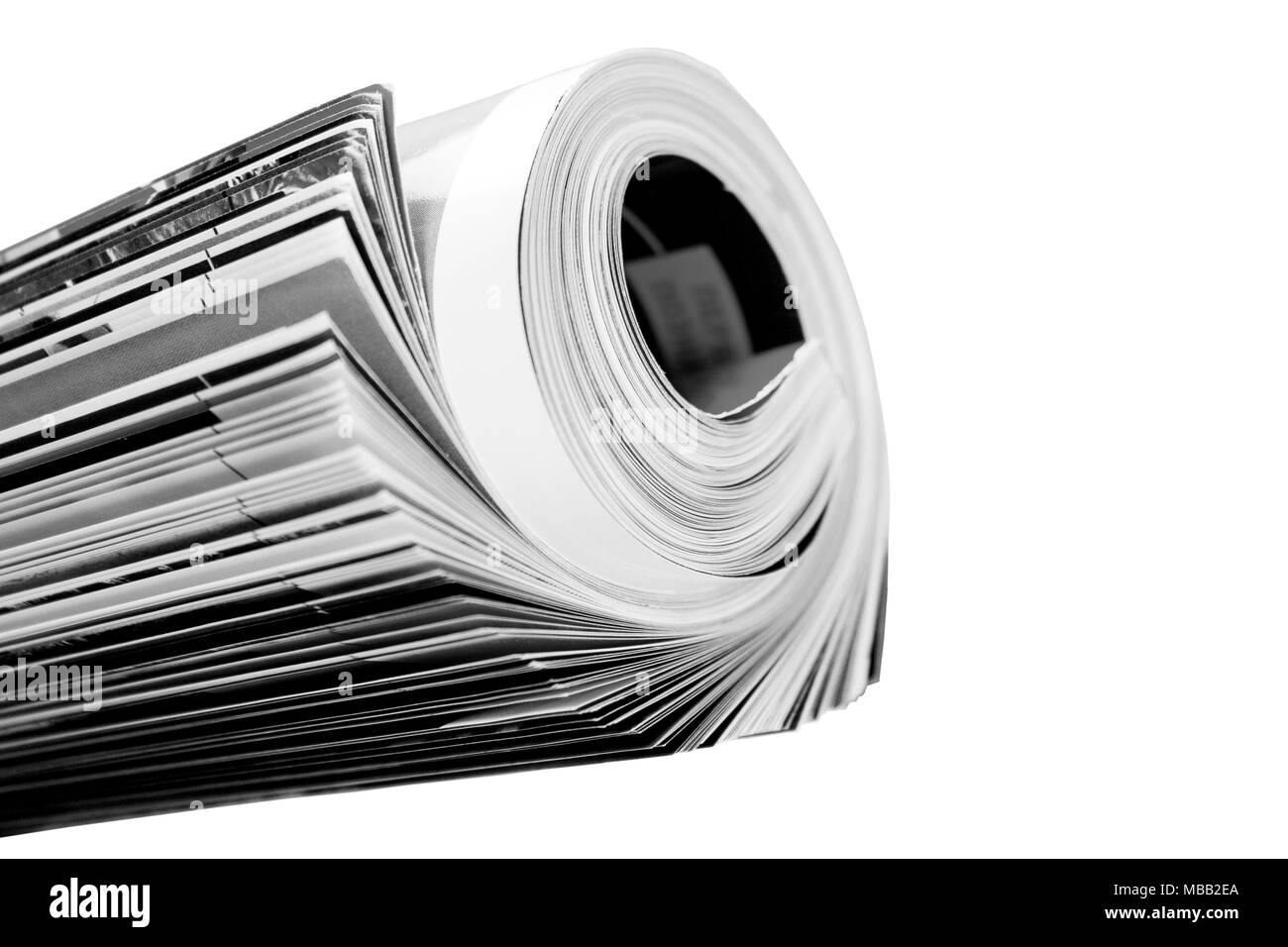 rolled up magazine over white Stock Photo - Alamy