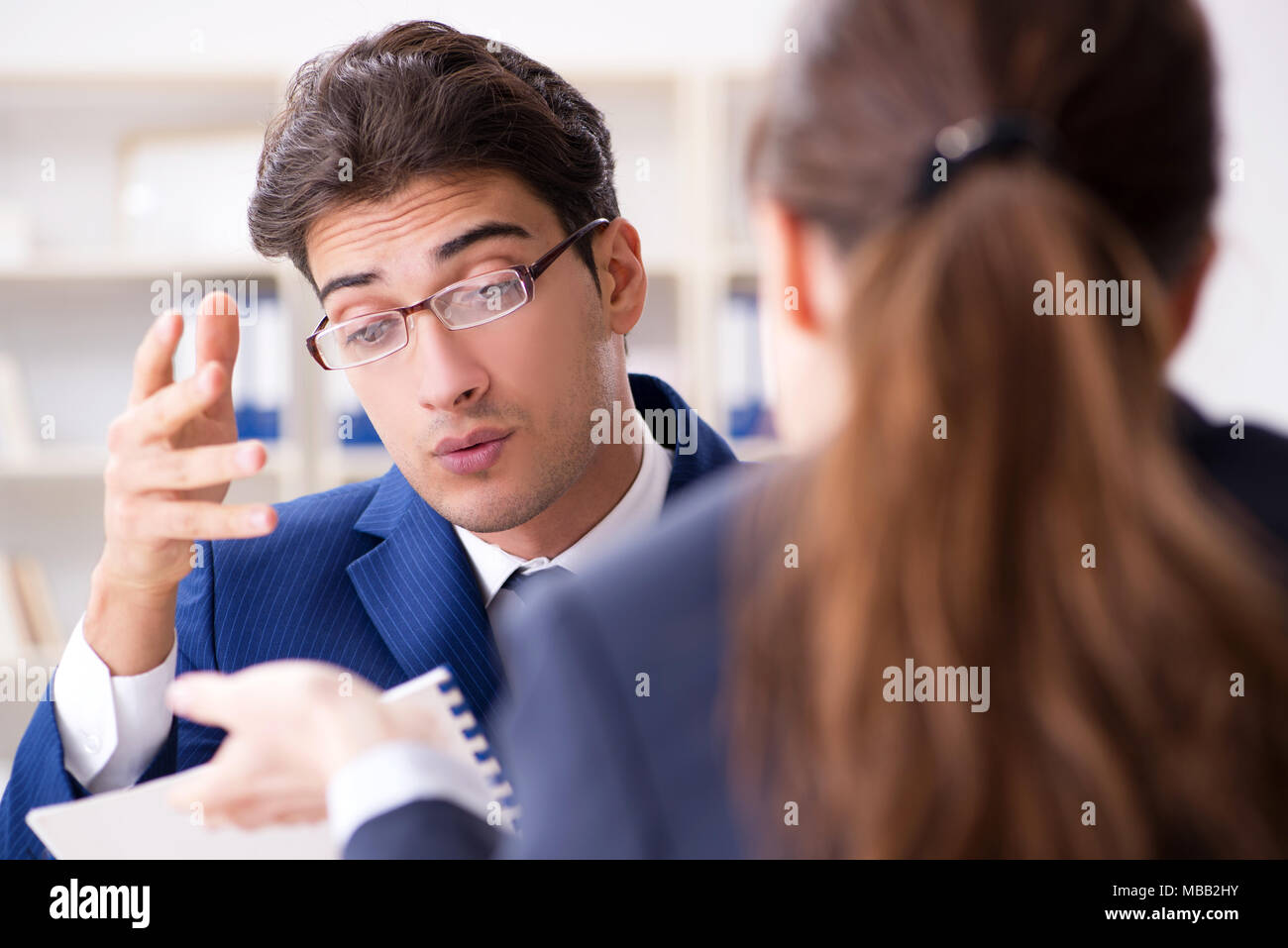Lawyer talking to his client in office Stock Photo - Alamy