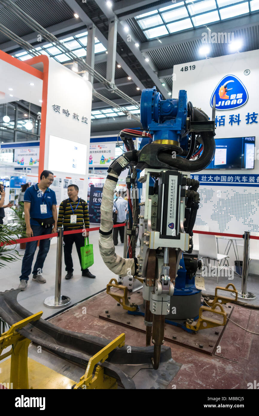 Industrial manufacturing robot exhibit at technology fair in Shenzhen ...