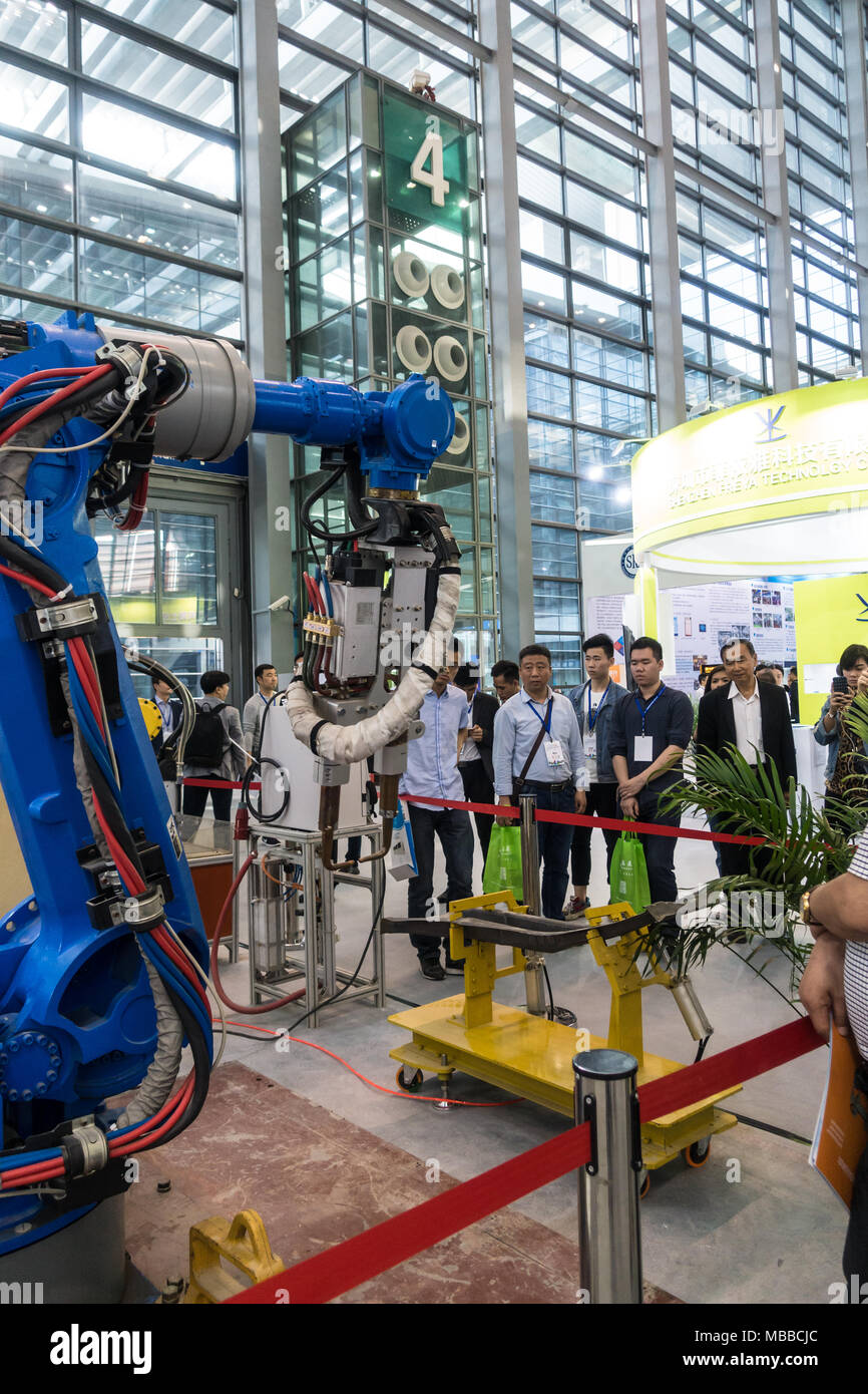 Industrial manufacturing robot exhibit at technology fair in Shenzhen ...