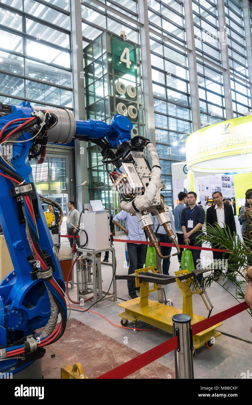 Industrial manufacturing robot exhibit at technology fair in Shenzhen ...