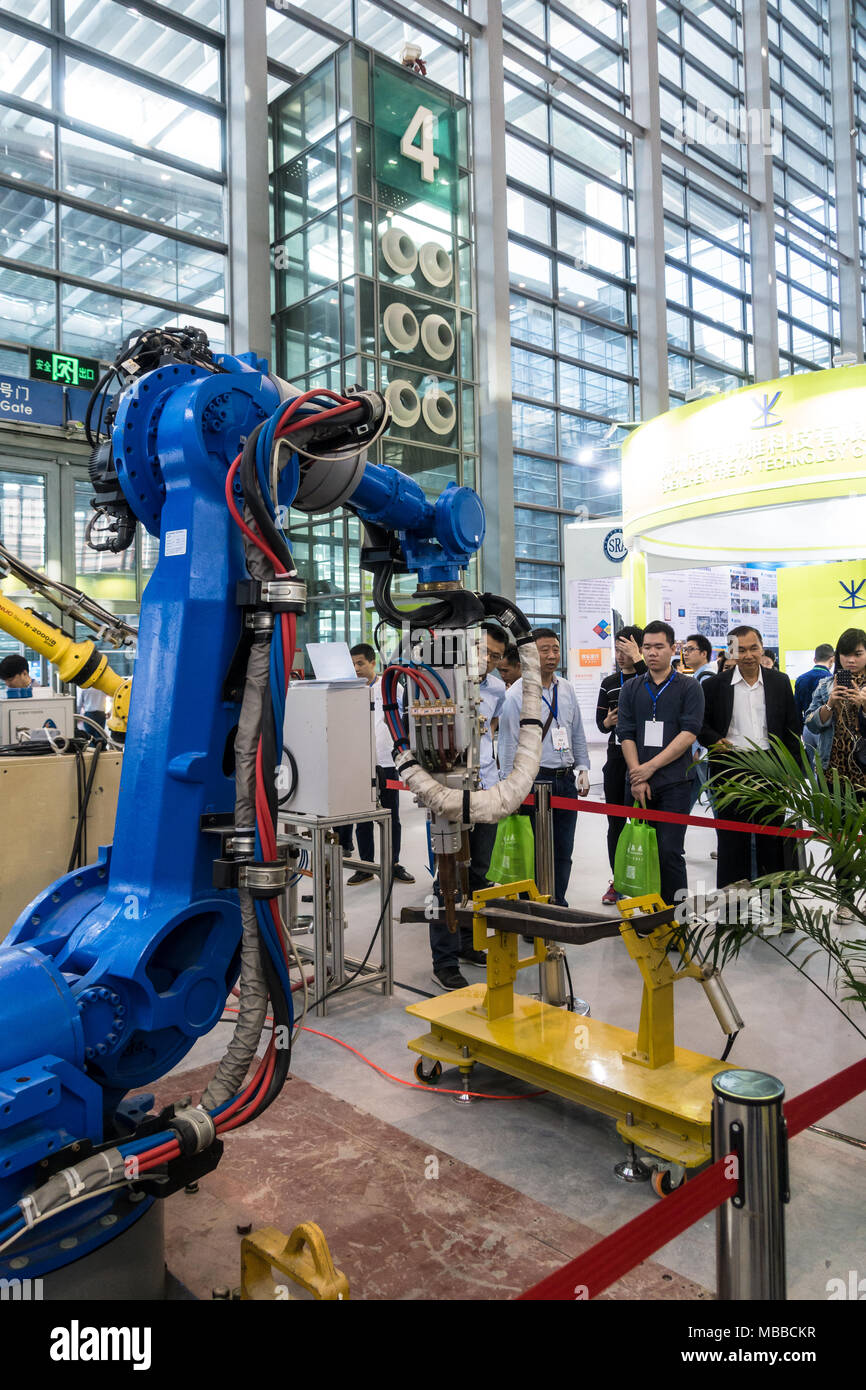 Industrial manufacturing robot exhibit at technology fair in Shenzhen ...