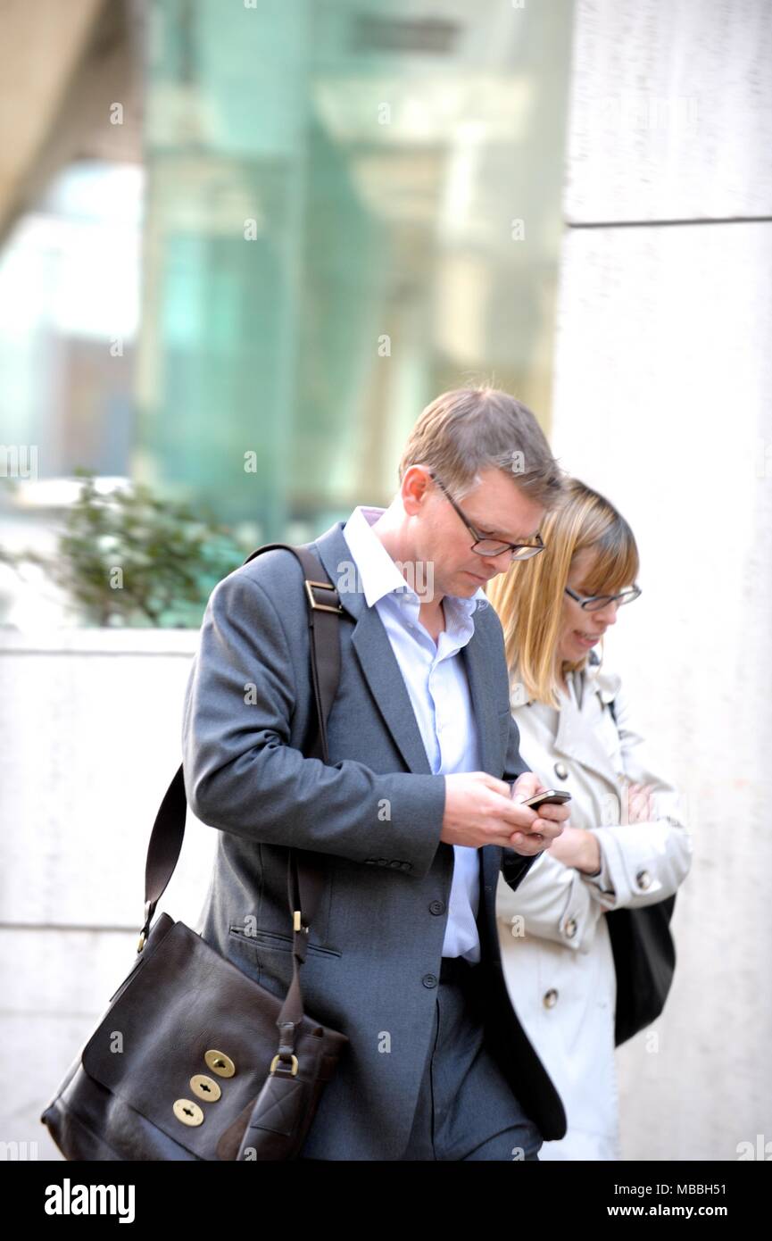 People on their cellphones Stock Photo - Alamy