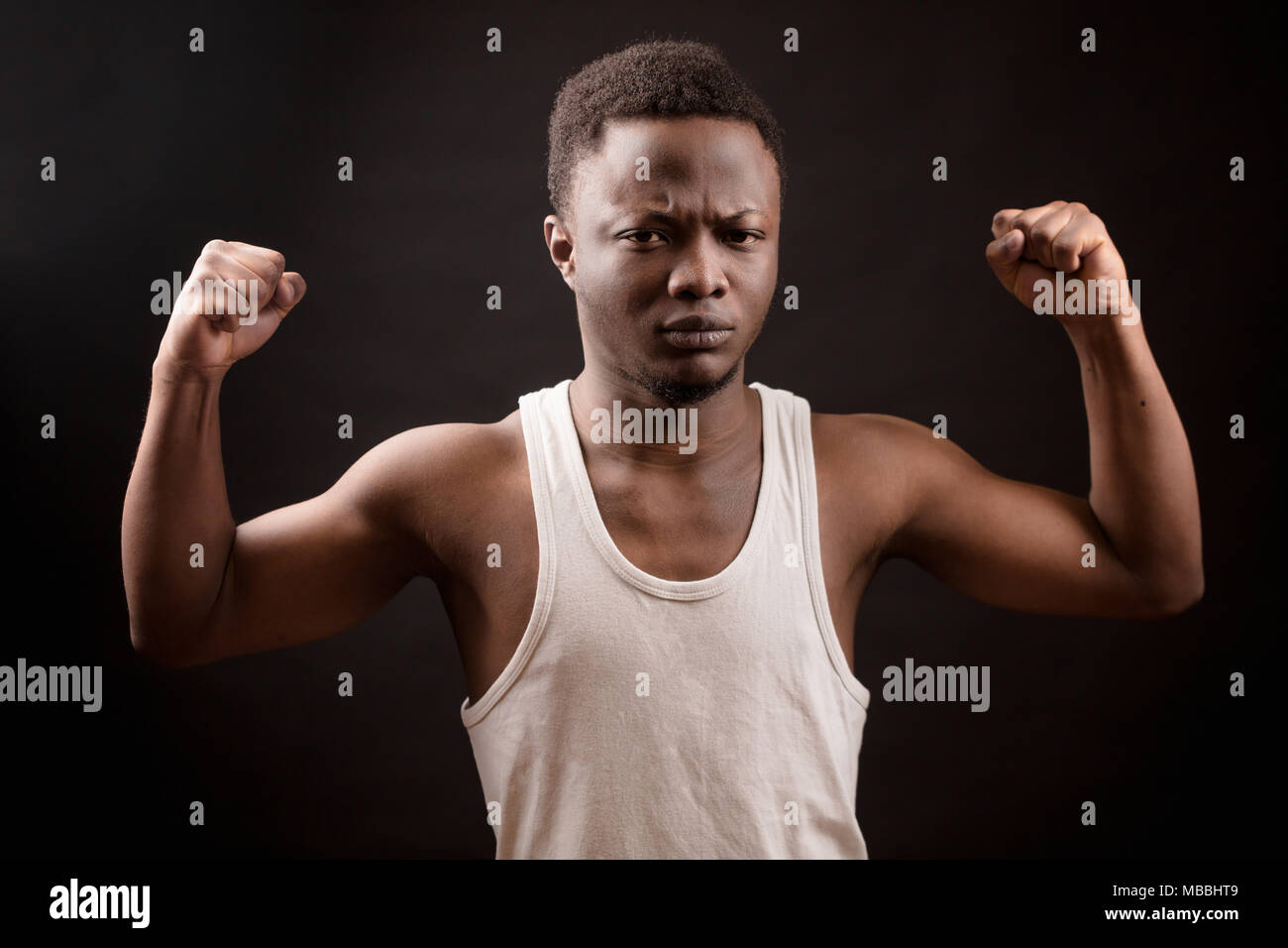 angry athlete with serious face is practising bodybuilding Stock Photo ...