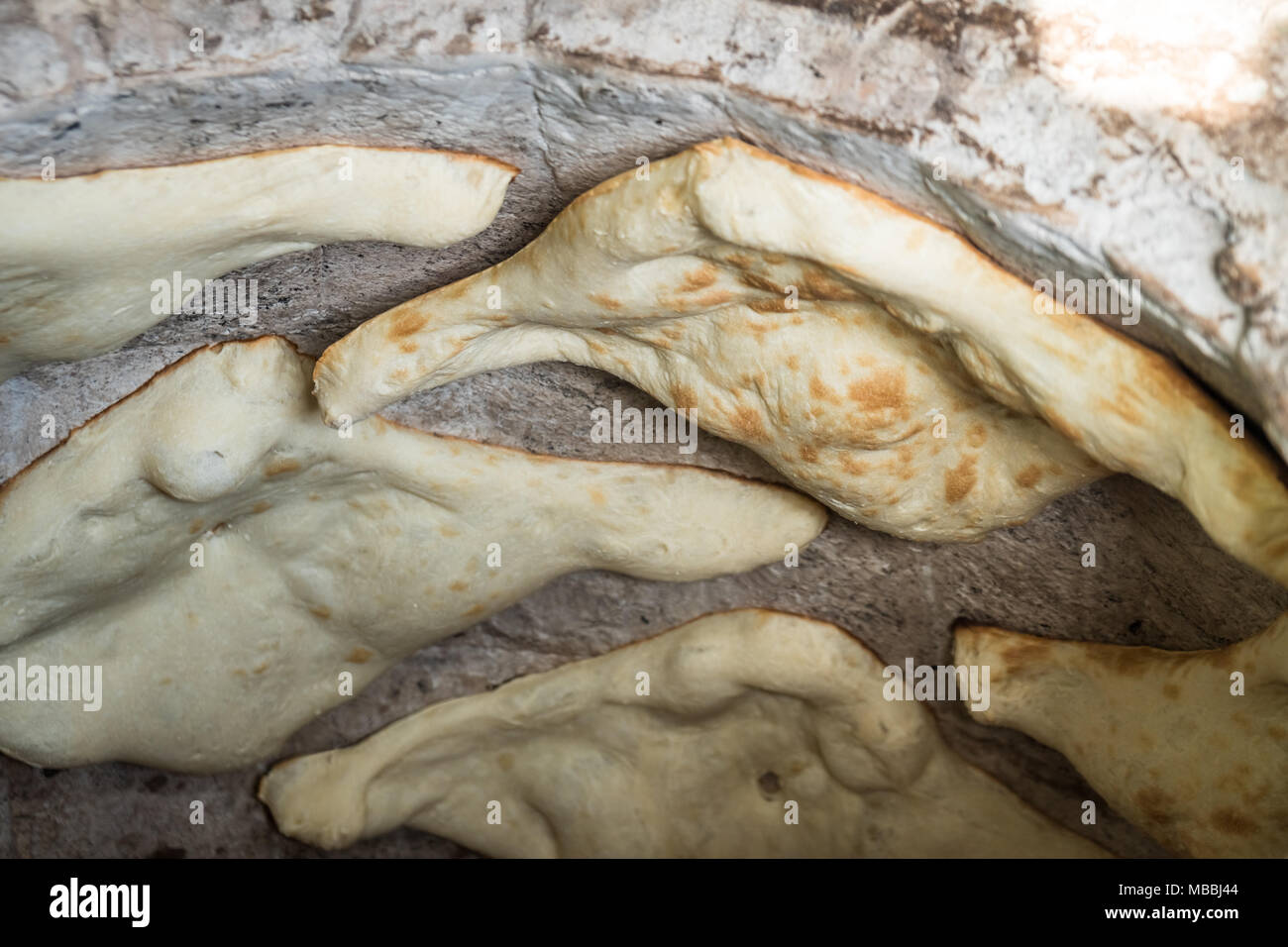Georgian traditional brick oven. Traditional georgian breads. Cooking ...
