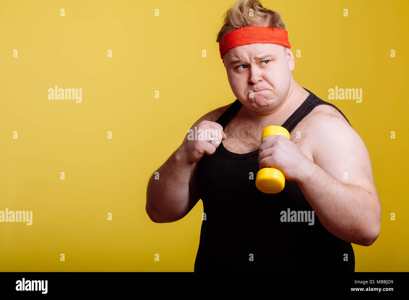 Fat man boxing and looking camera Stock Photo - Alamy