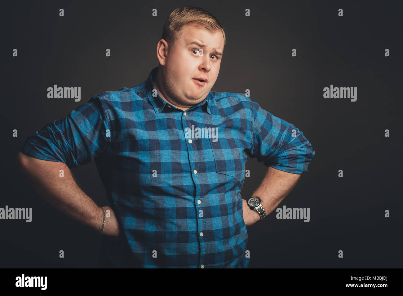 Fat caucasian man thinking and looking up to copyspace Stock Photo - Alamy