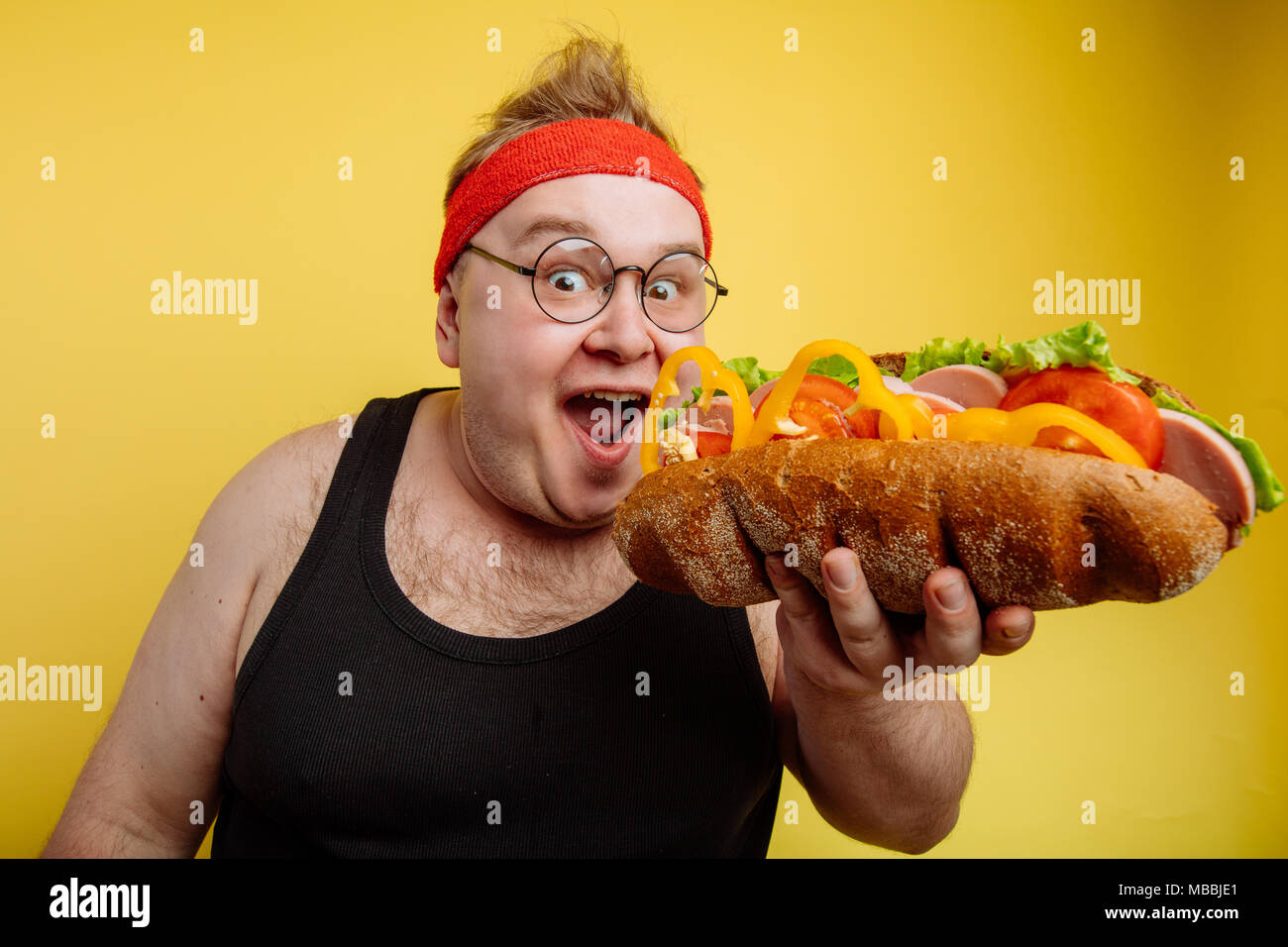 fat man eating fast food hamberger Stock Photo - Alamy