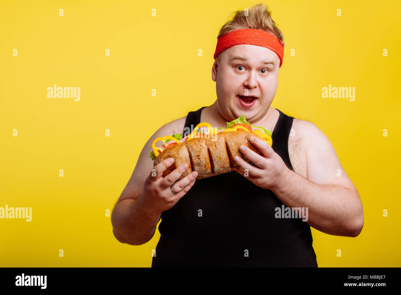 fat man eating fast food hamberger Stock Photo - Alamy