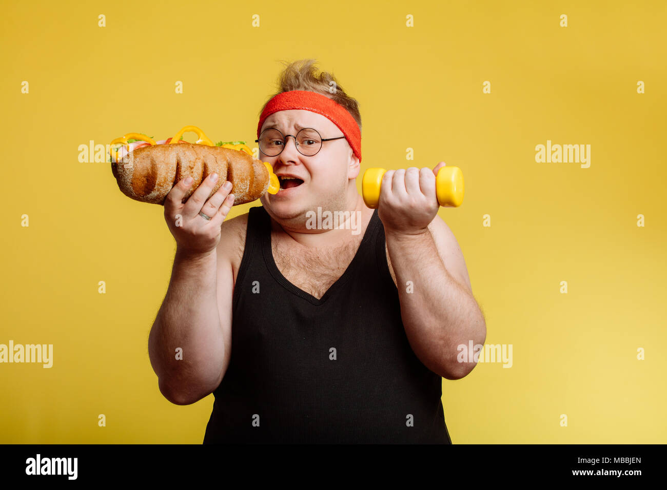 fat man eating fast food hamberger Stock Photo - Alamy