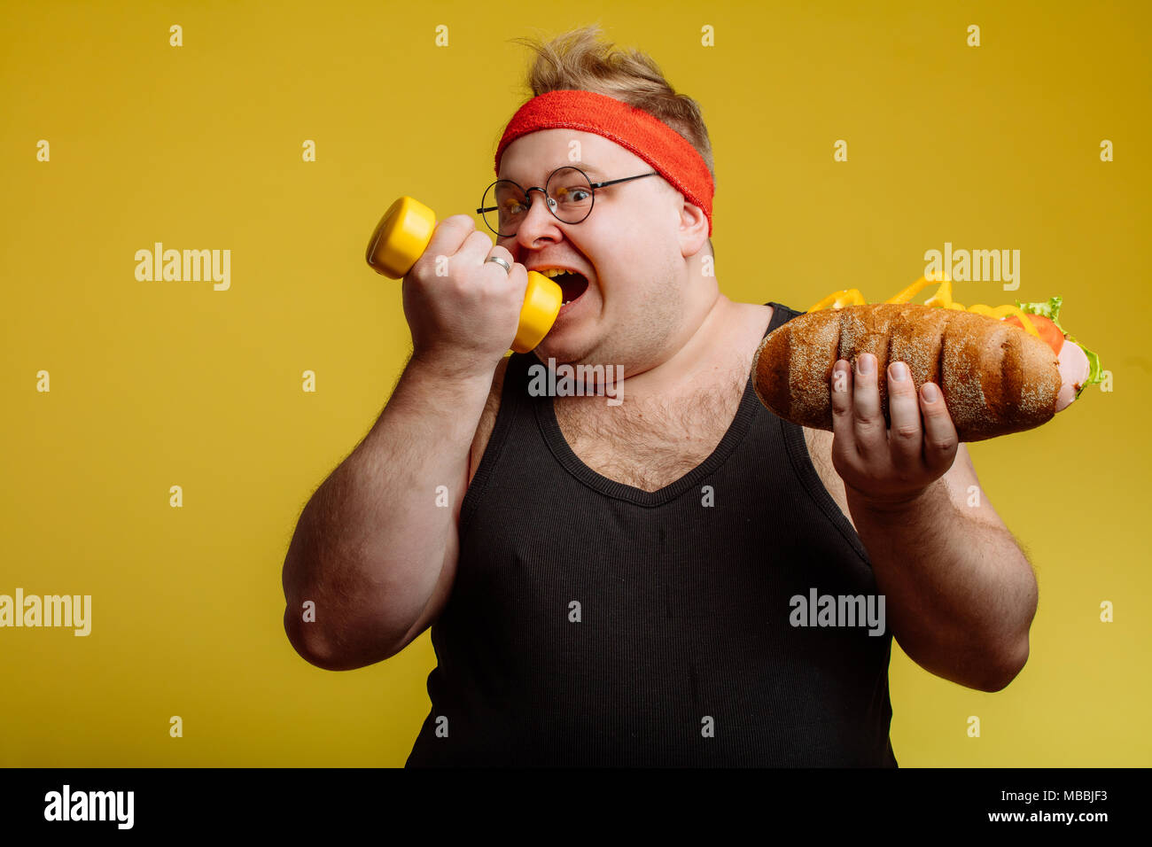 fat man eating fast food hamberger Stock Photo - Alamy