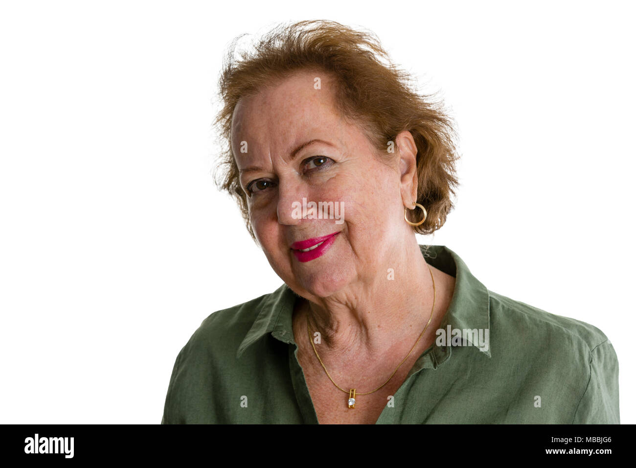 Portrait of smiling senior lady against white background Stock Photo ...