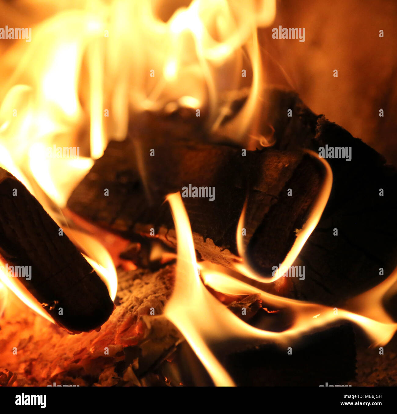 burned wood with flames and fire Stock Photo - Alamy