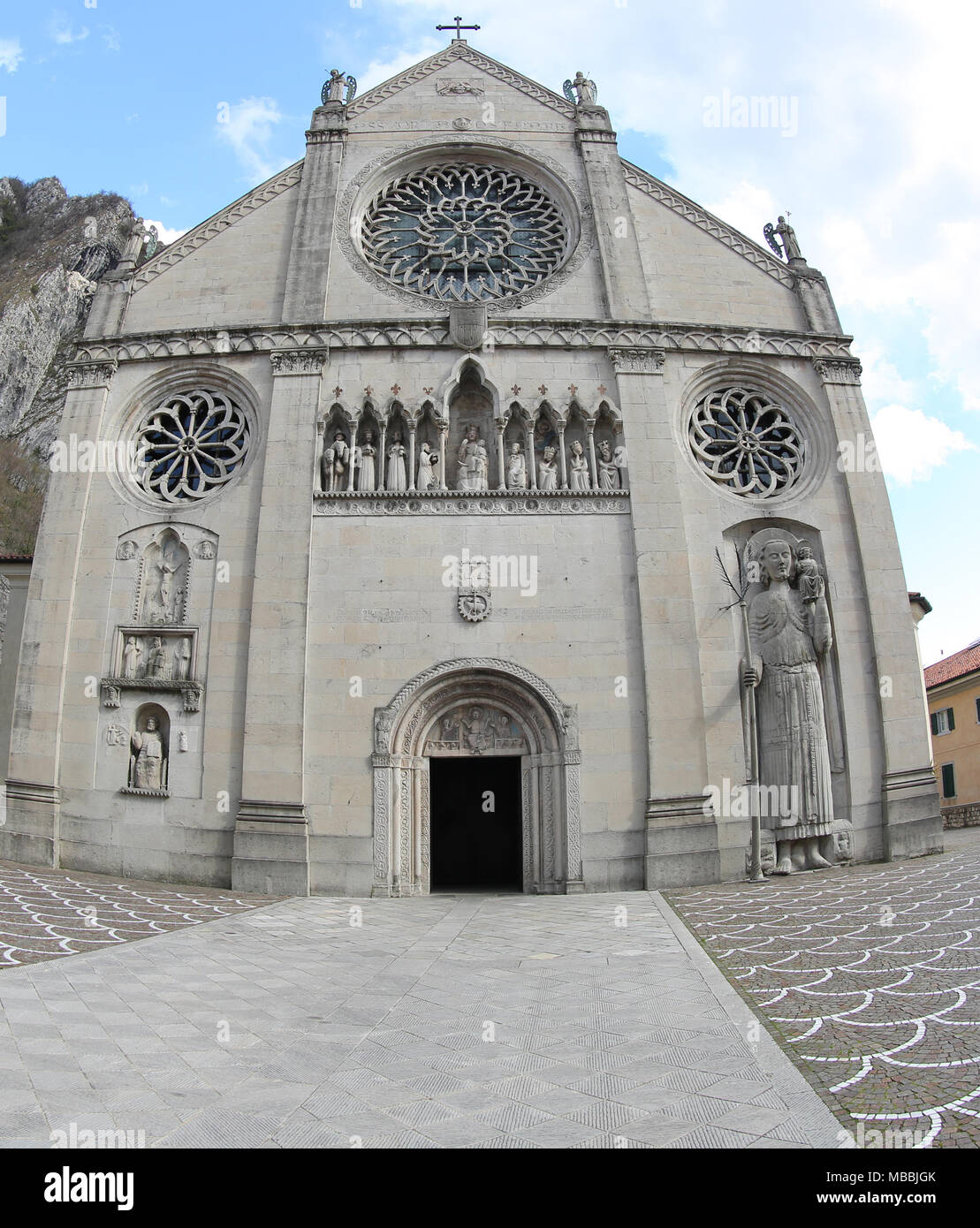 facade of ancient Cathedral in Gemona del Friuli in Northern Italy. The ...