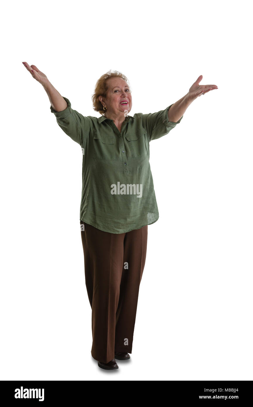 Cheerful grandmother standing with welcoming gesture against white ...