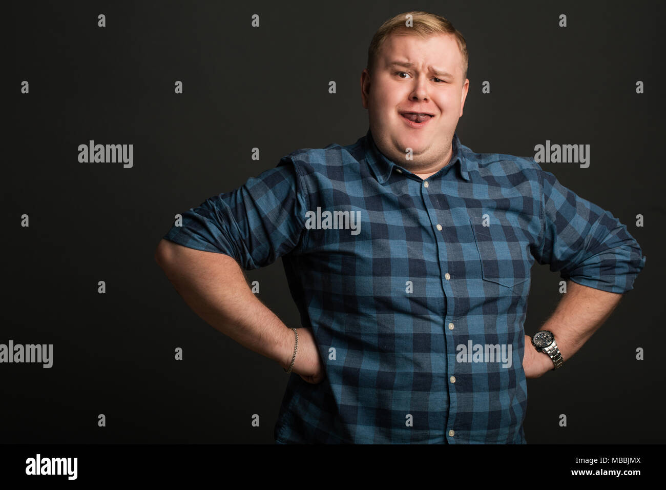 proud young man on black background Stock Photo - Alamy
