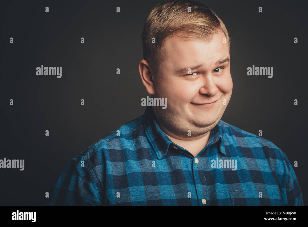 smiling fat man on black background Stock Photo - Alamy
