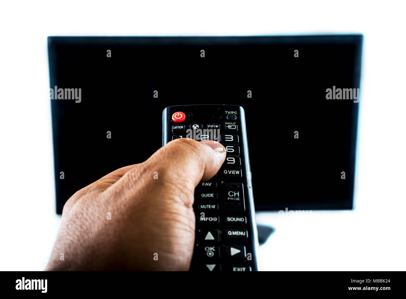 hand holding a remote control and behind a tv on white background Stock ...
