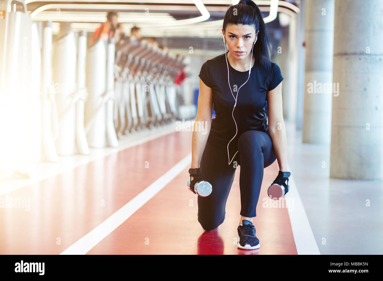 dumbbell lunge woman workout exercise at gym, one leg split squats ...