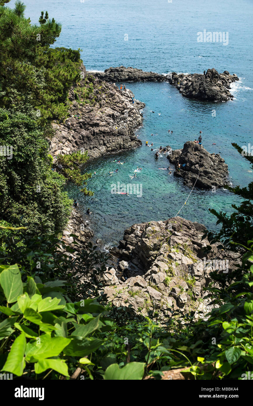 Seogwipo, Jeju Island, Korea - August 26 2017: People swimming and ...