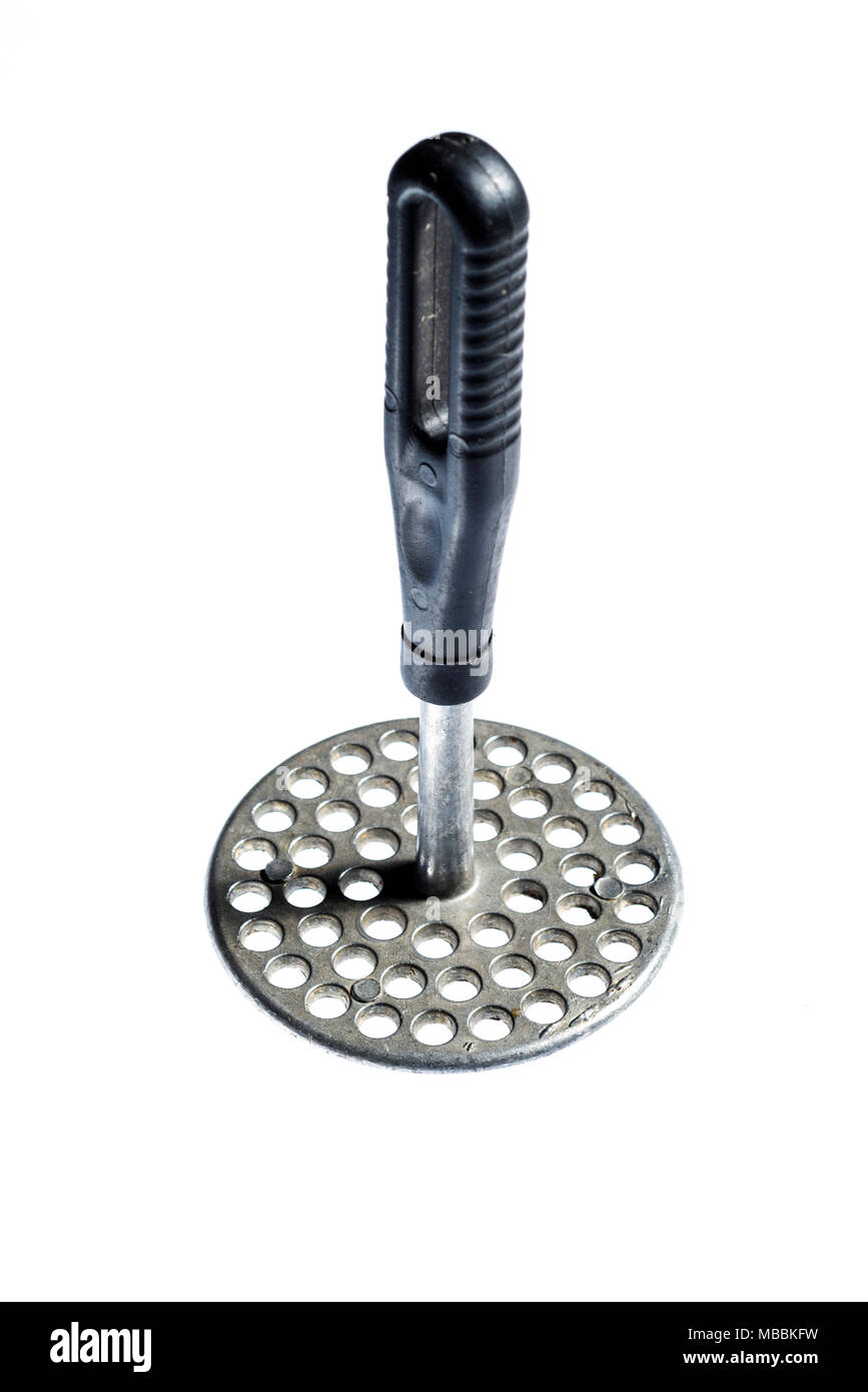 Metal masher potato with black plastic handle, over white background ...