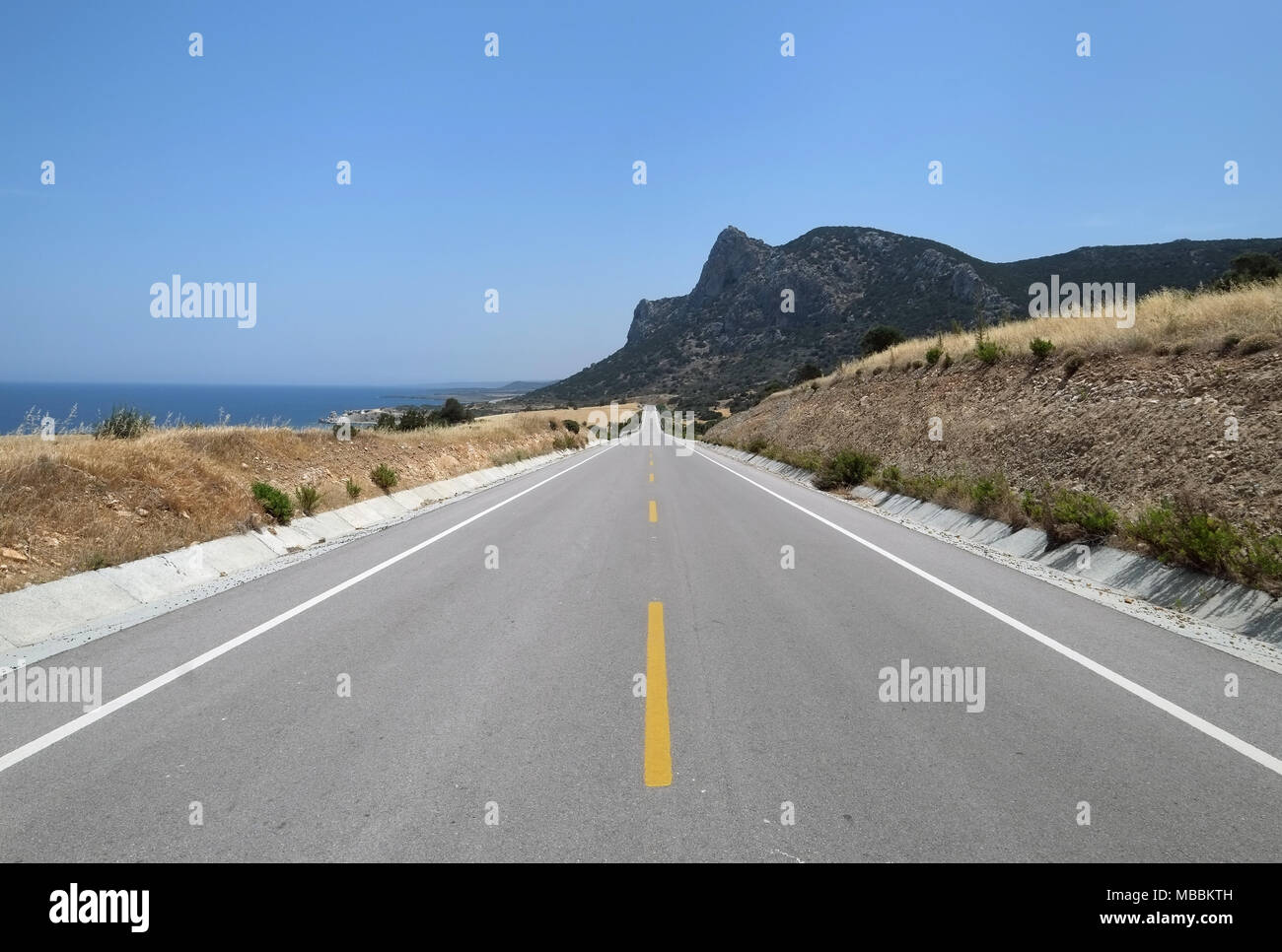 Long straight main road on the Karpass Peninsula, Northern Cyprus Stock ...