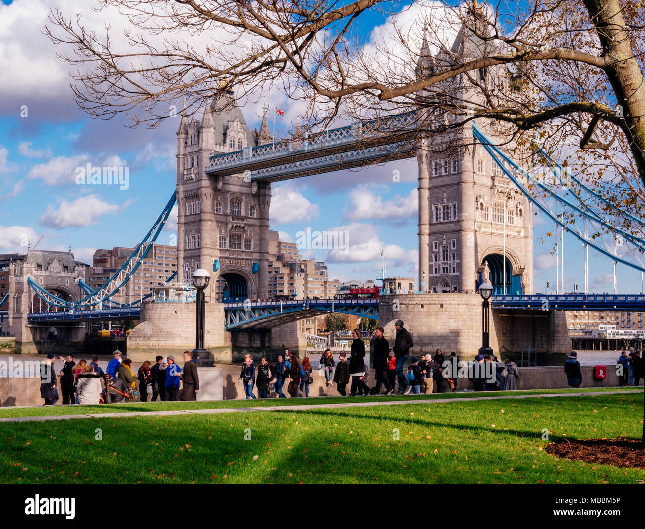 People walking along embankment by Tower Bridge, London SE1, UK Stock ...