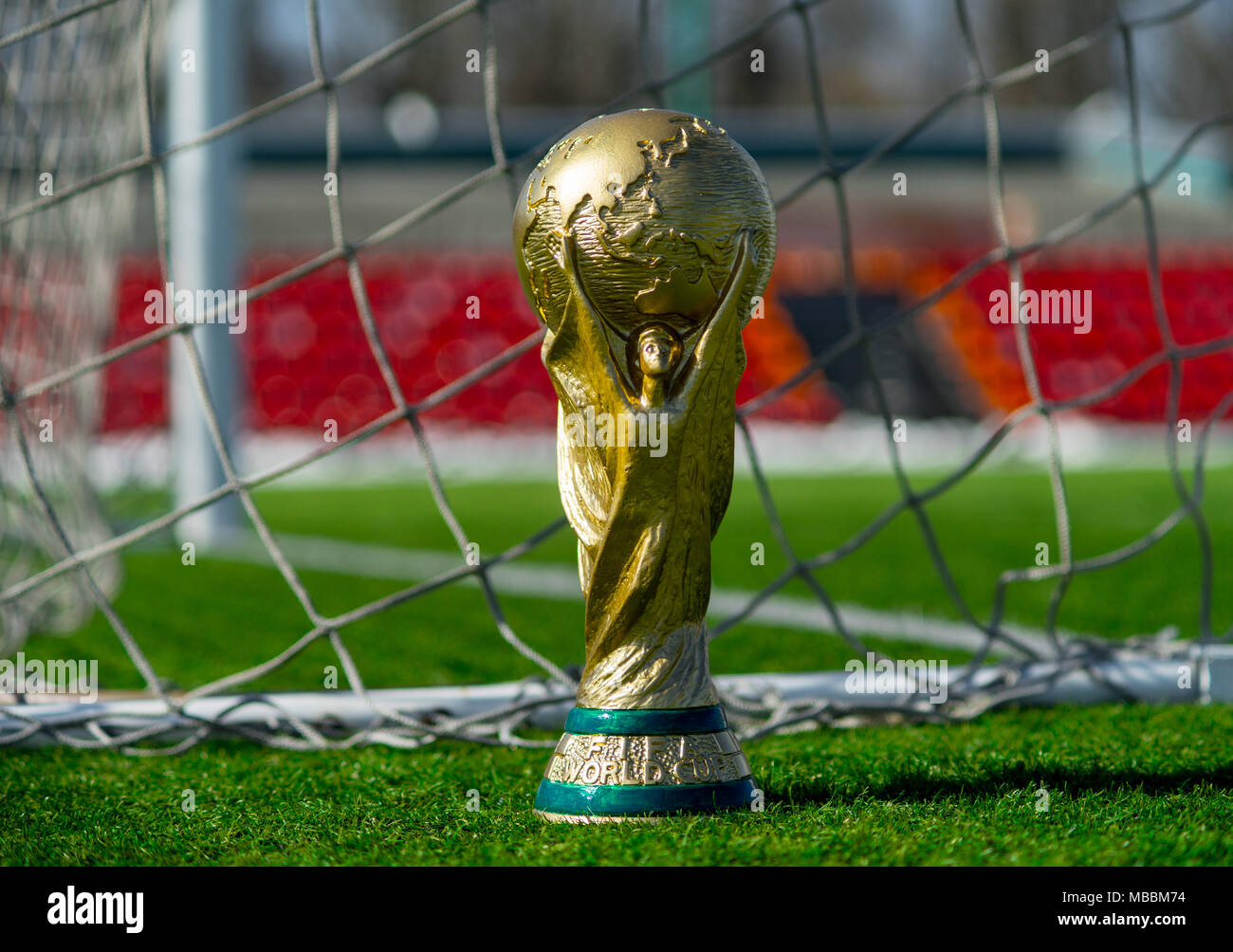 April 9, 2018 Moscow, Russia Trophy of the FIFA World Cup on the green ...