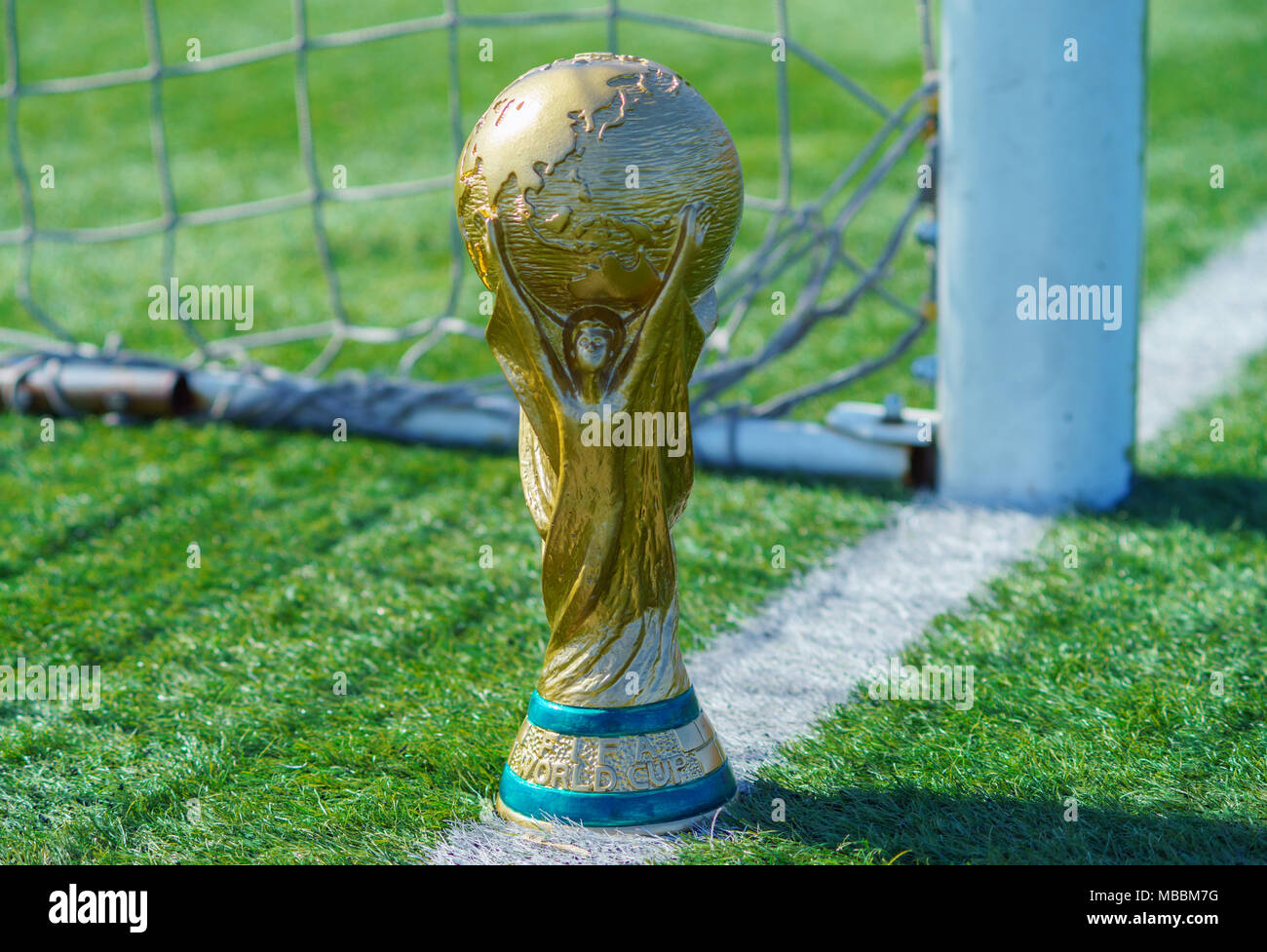 April 9, 2018 Moscow, Russia Trophy of the FIFA World Cup on the green ...