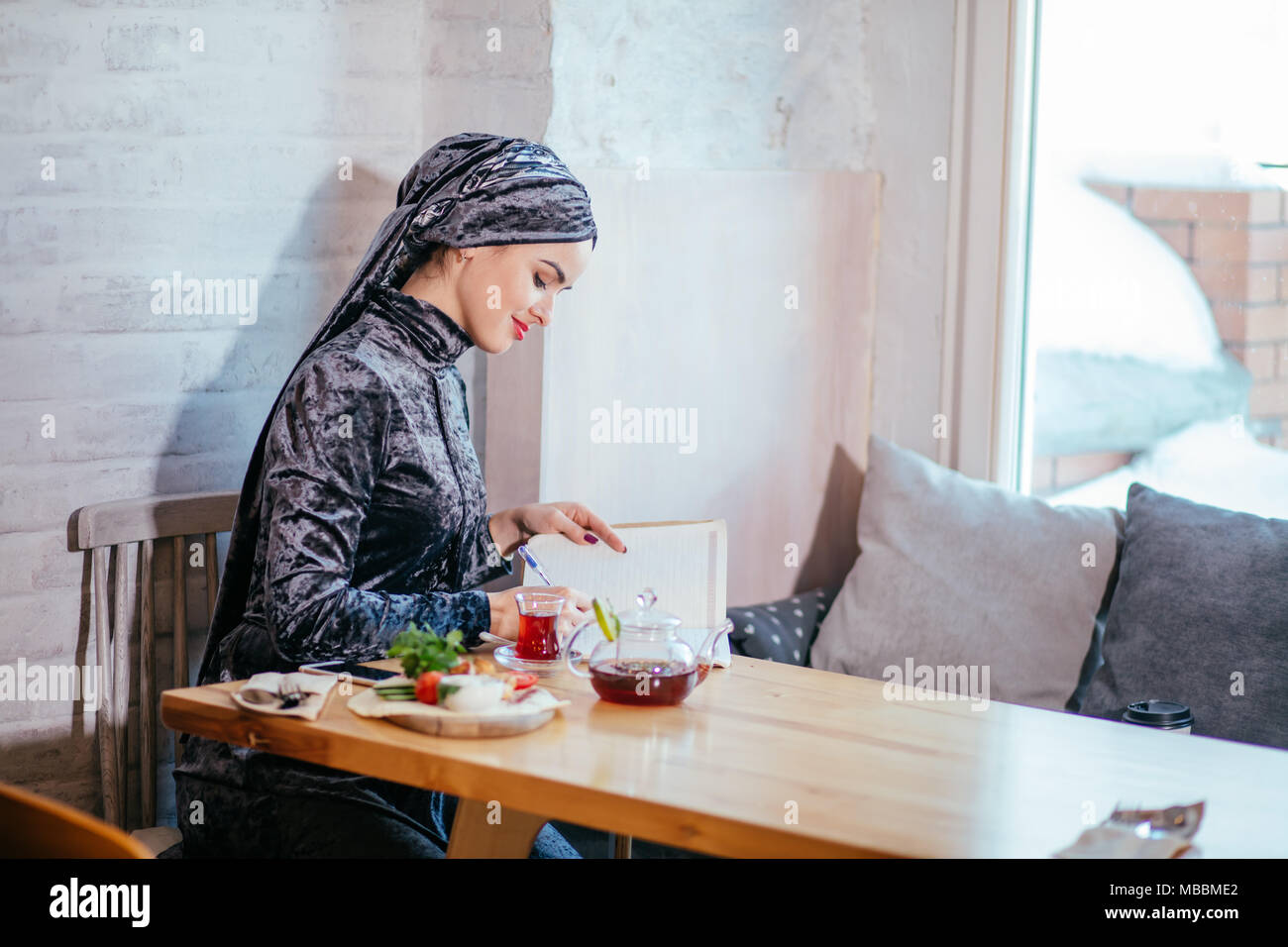 muslim woman working in cafe Stock Photo - Alamy