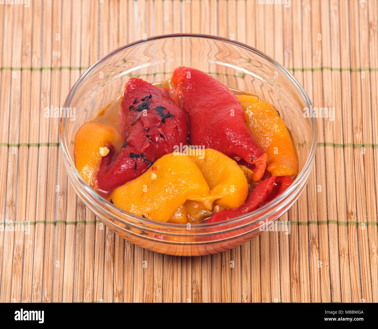 Fire roasted yellow and red peppers Stock Photo - Alamy