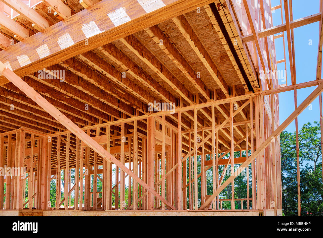 Wood frame interior of a new house under construction Stock Photo - Alamy