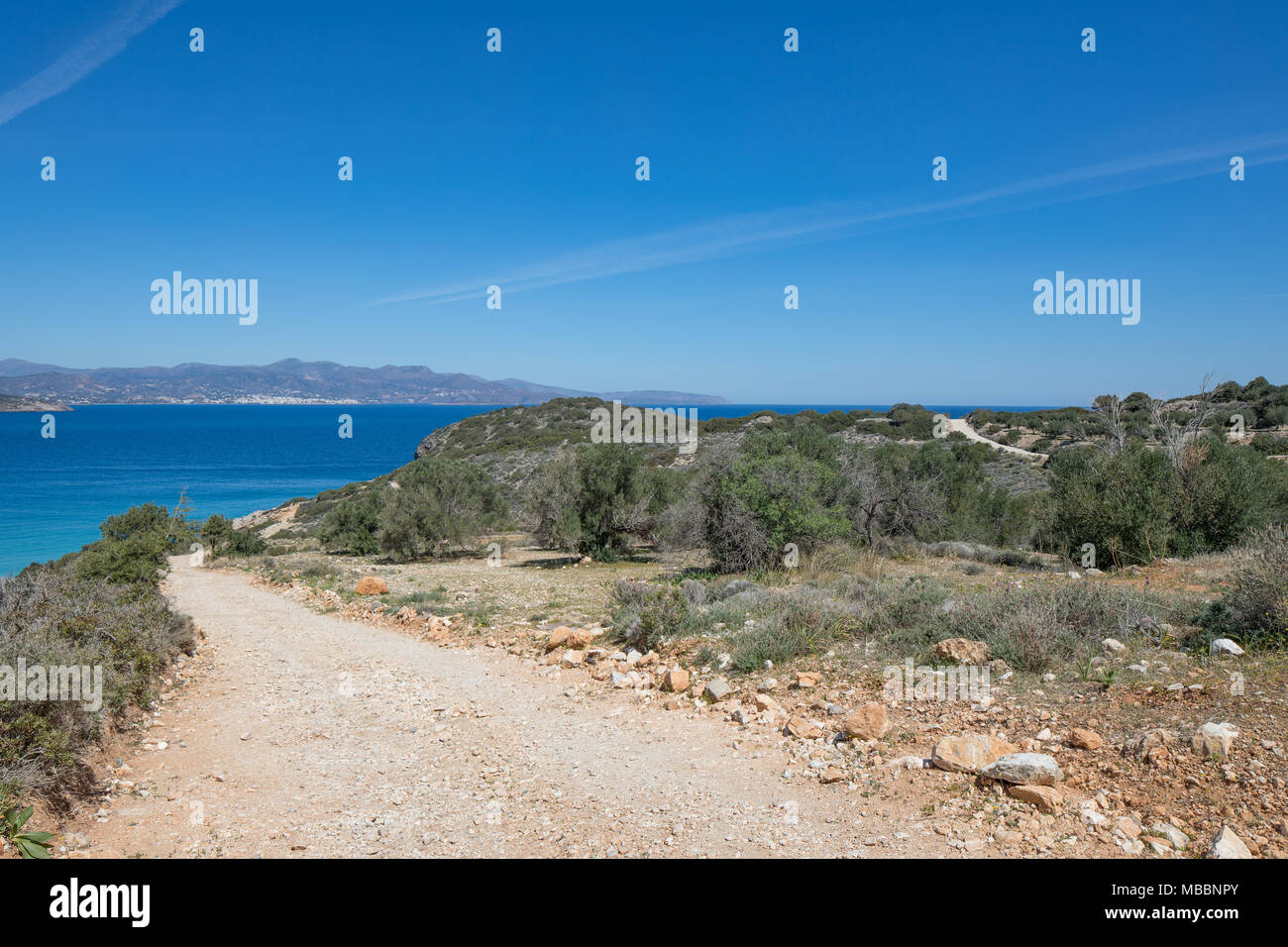 Crete landscape, blue sea and sky on a sunny day in background, rocks ...