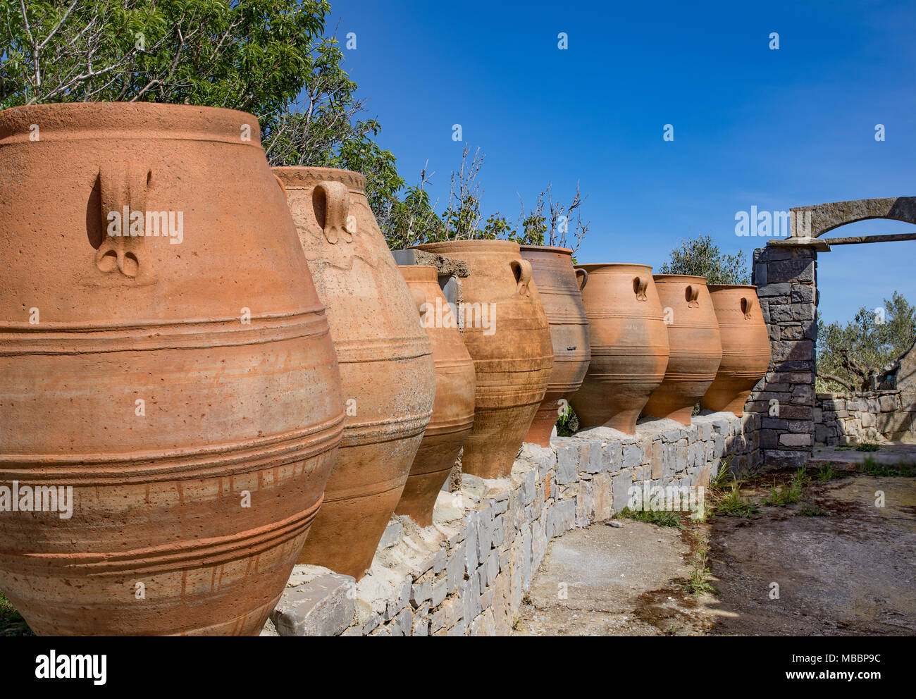 Old clay jugs in the bow line. Traditional greek clay pottery, like ...