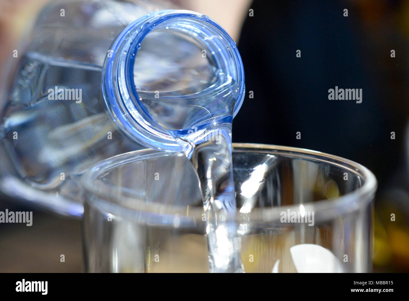Pouring cold water from a bottle into a glass,close upimage Stock Photo ...