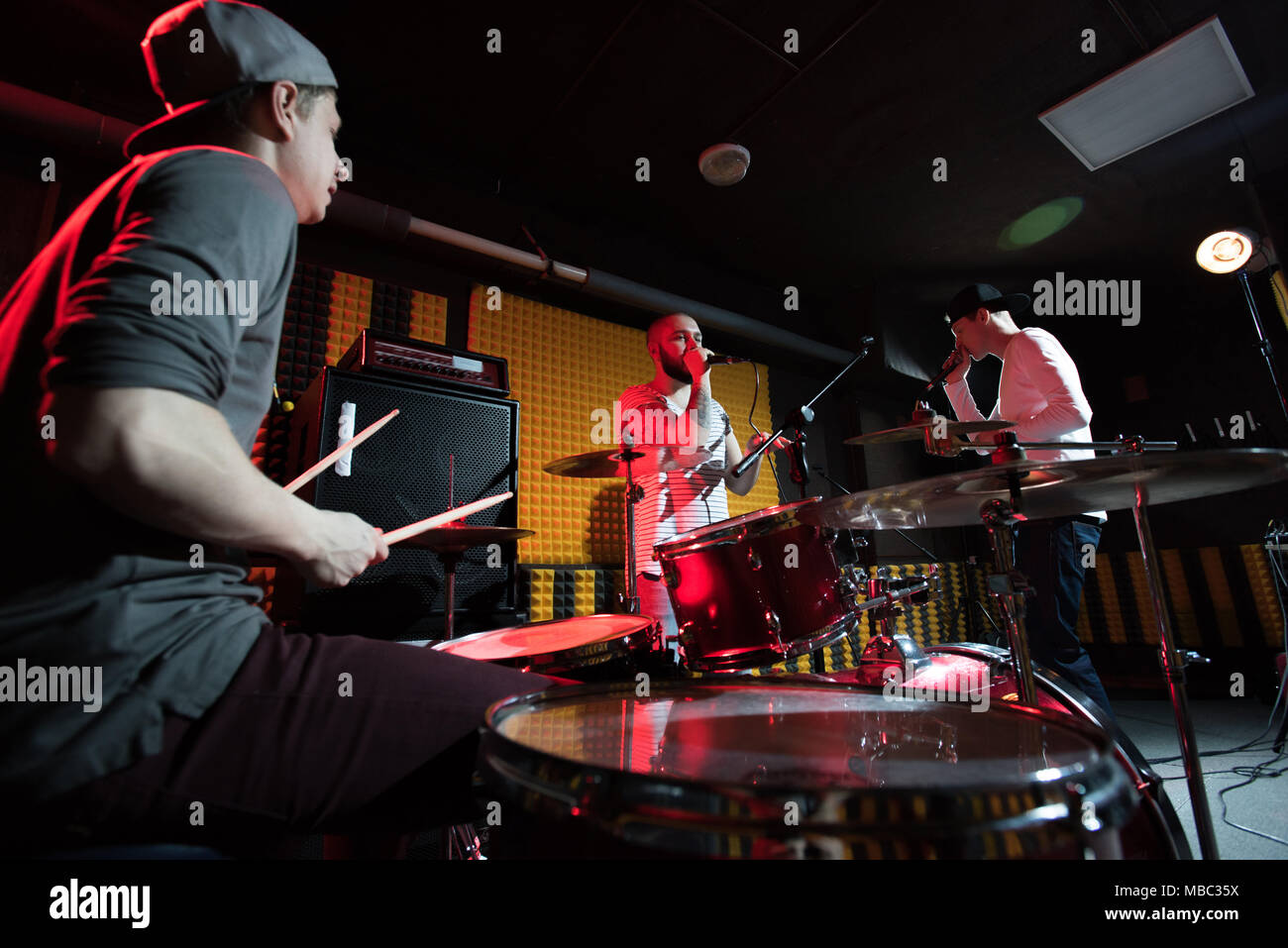 Band Recording Music in Studio Stock Photo - Alamy