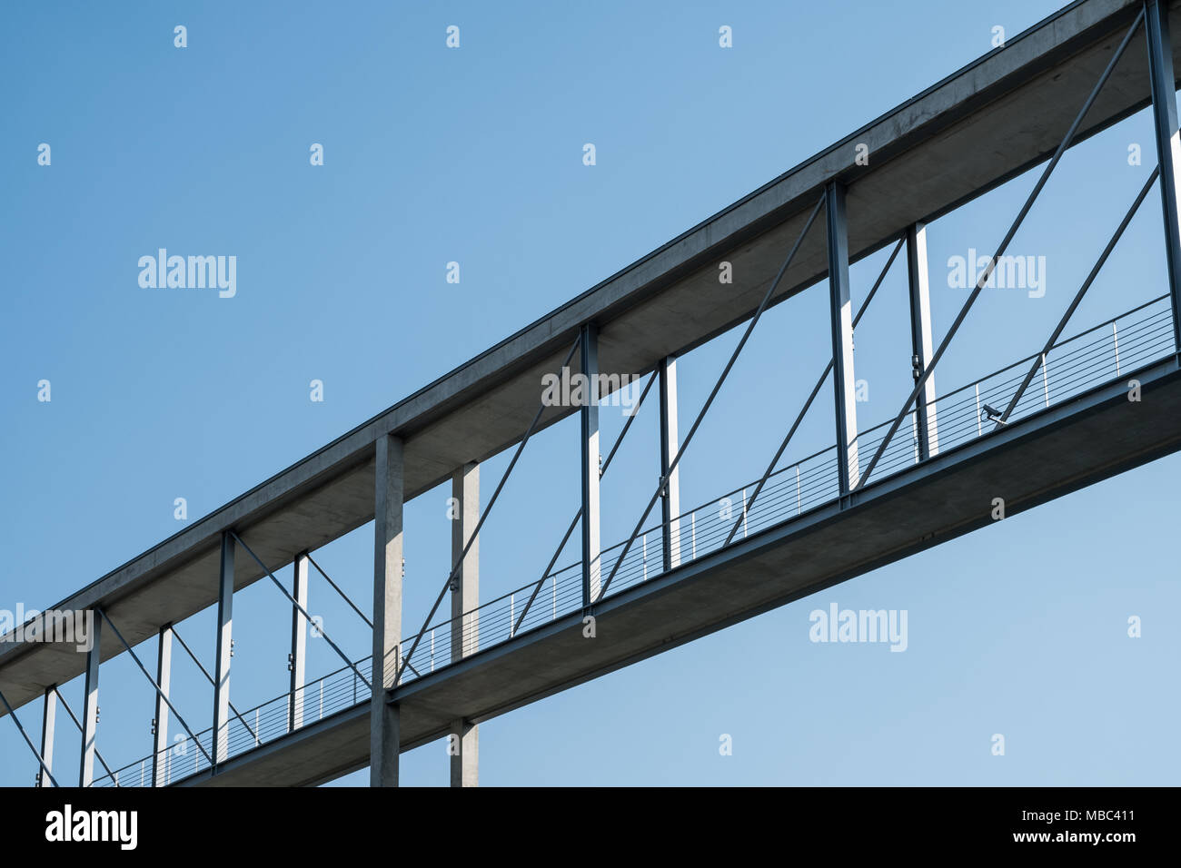 elevated pedestrian walkway / bridge on blue sky - concrete overpass ...