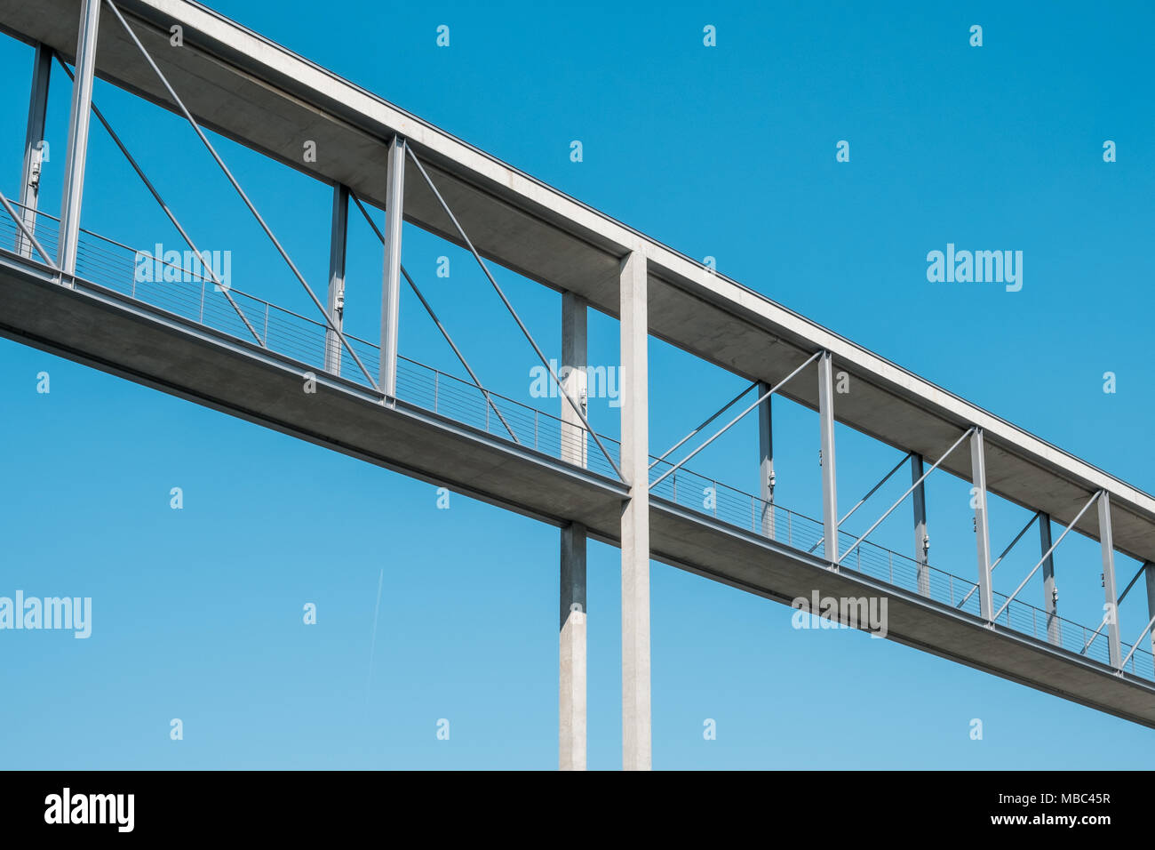elevated pedestrian walkway / bridge on blue sky - concrete overpass ...
