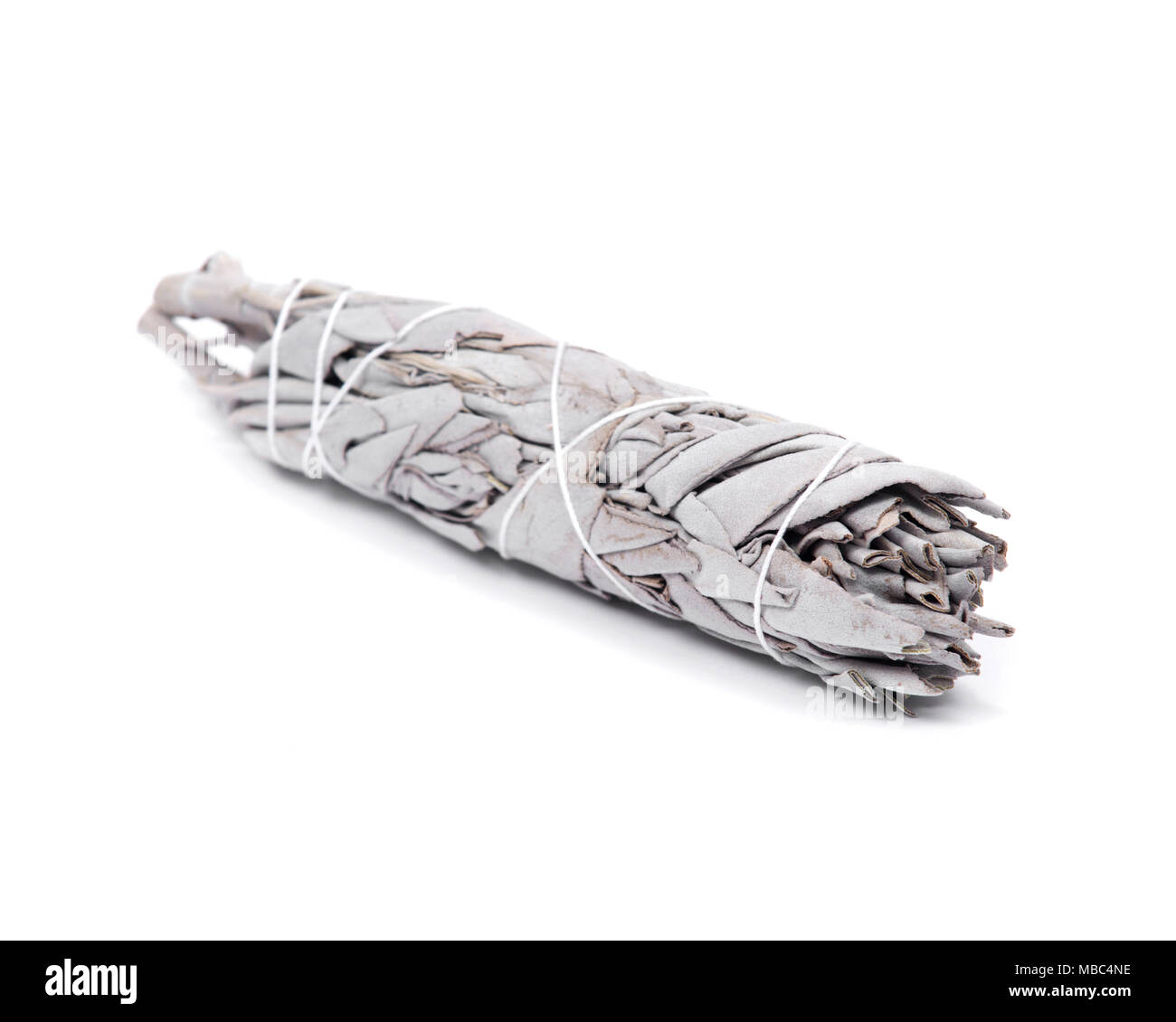 Sage smudge stick isolated on white background Stock Photo - Alamy