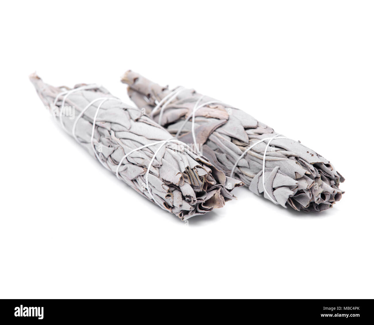 Sage smudge stick isolated on white background Stock Photo - Alamy