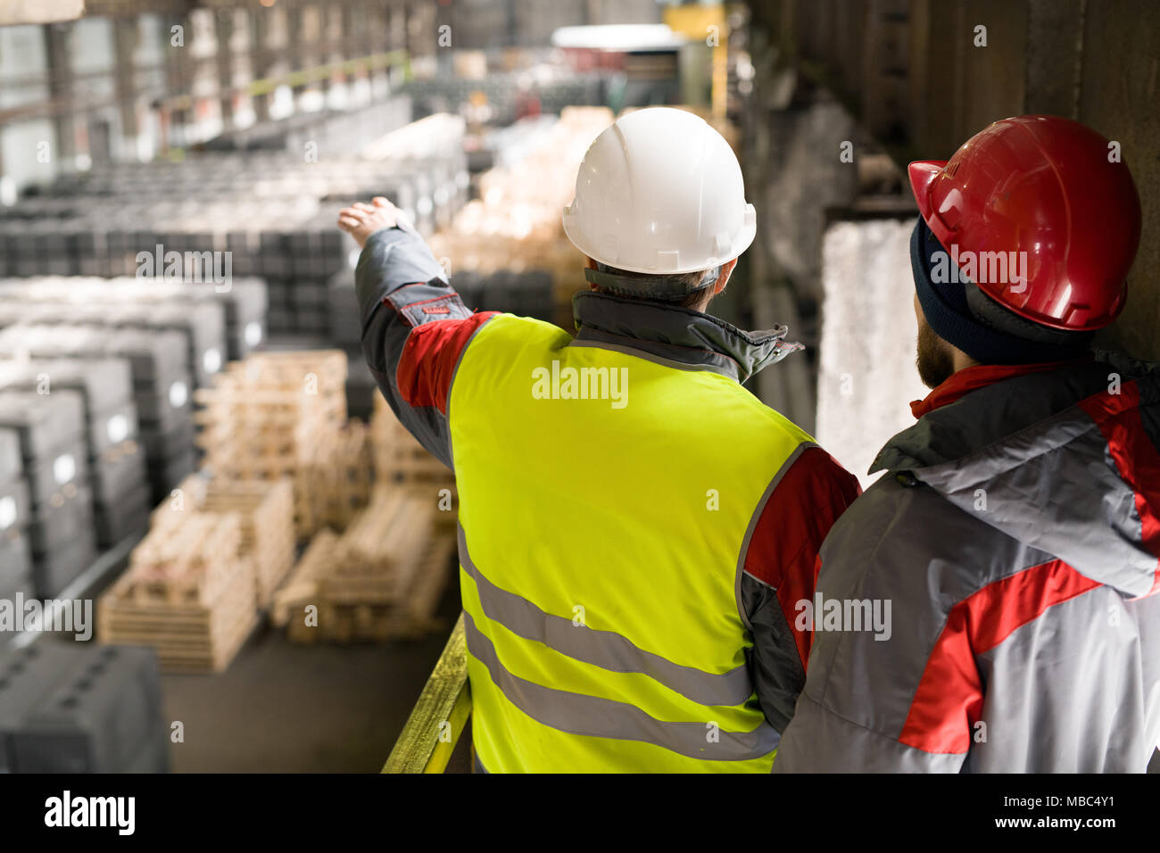 Workers Reviewing Production Stock Photo - Alamy Workers Reviewing Production Stock Photo - Alamy