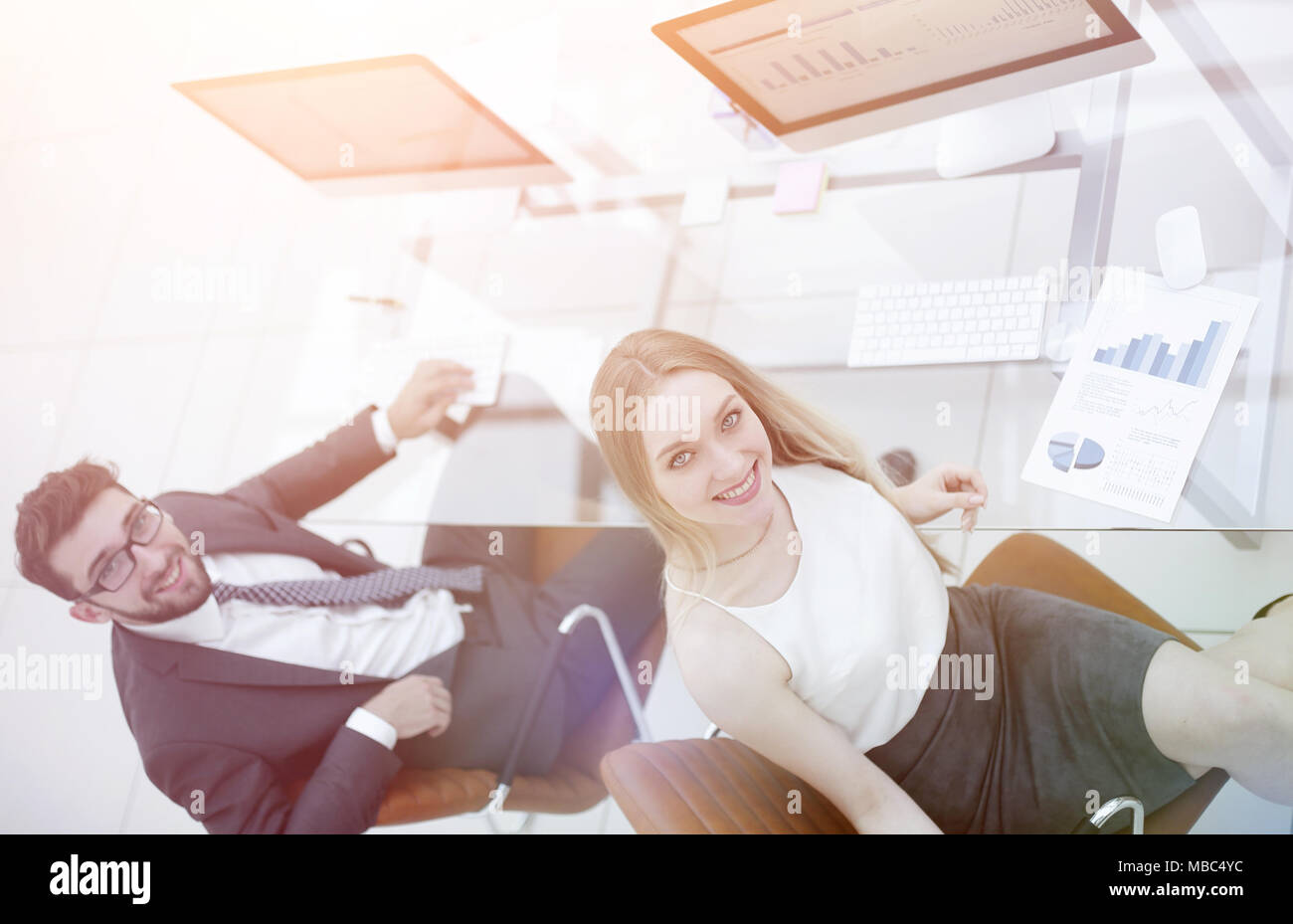 business people sitting at office desk in office. top view Stock Photo ...