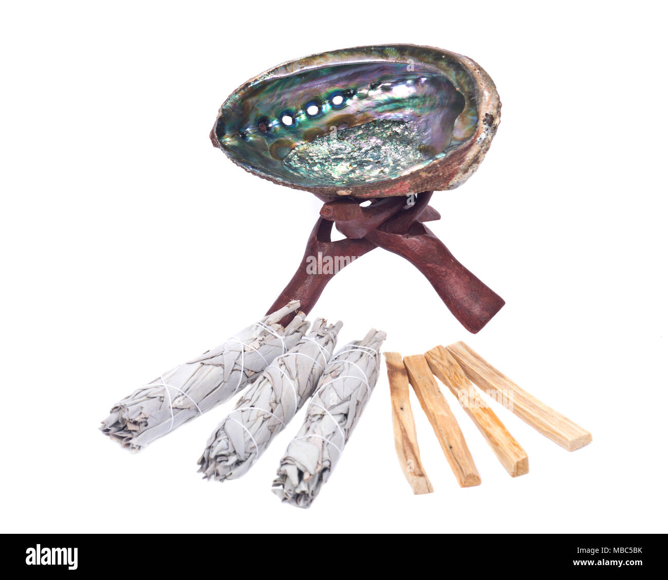 Sage smudge stick, bright polished rainbow abalone shell with wooden cobra stand and palo santo ...