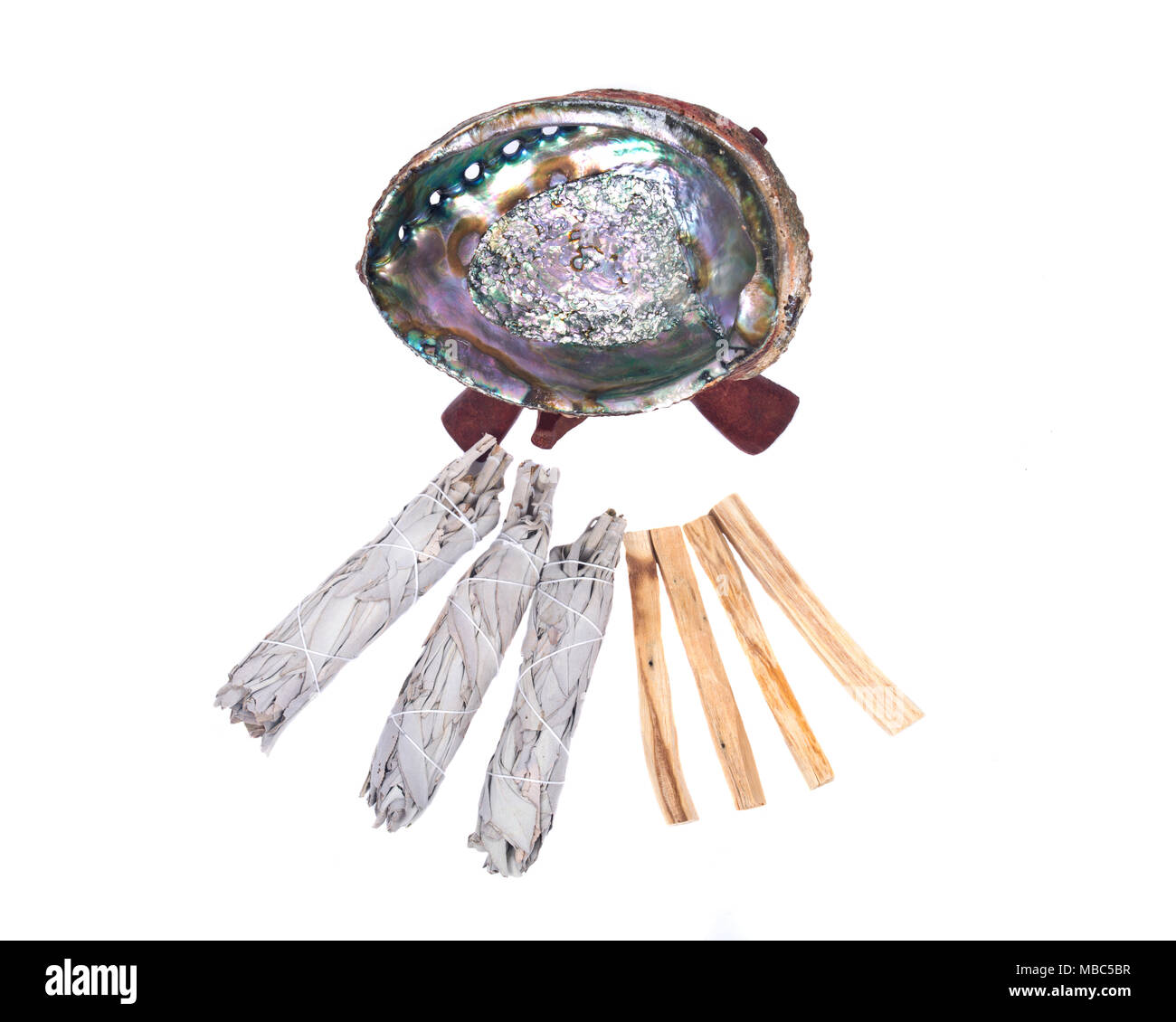 Sage smudge stick, bright polished rainbow abalone shell with wooden cobra stand and palo santo ...